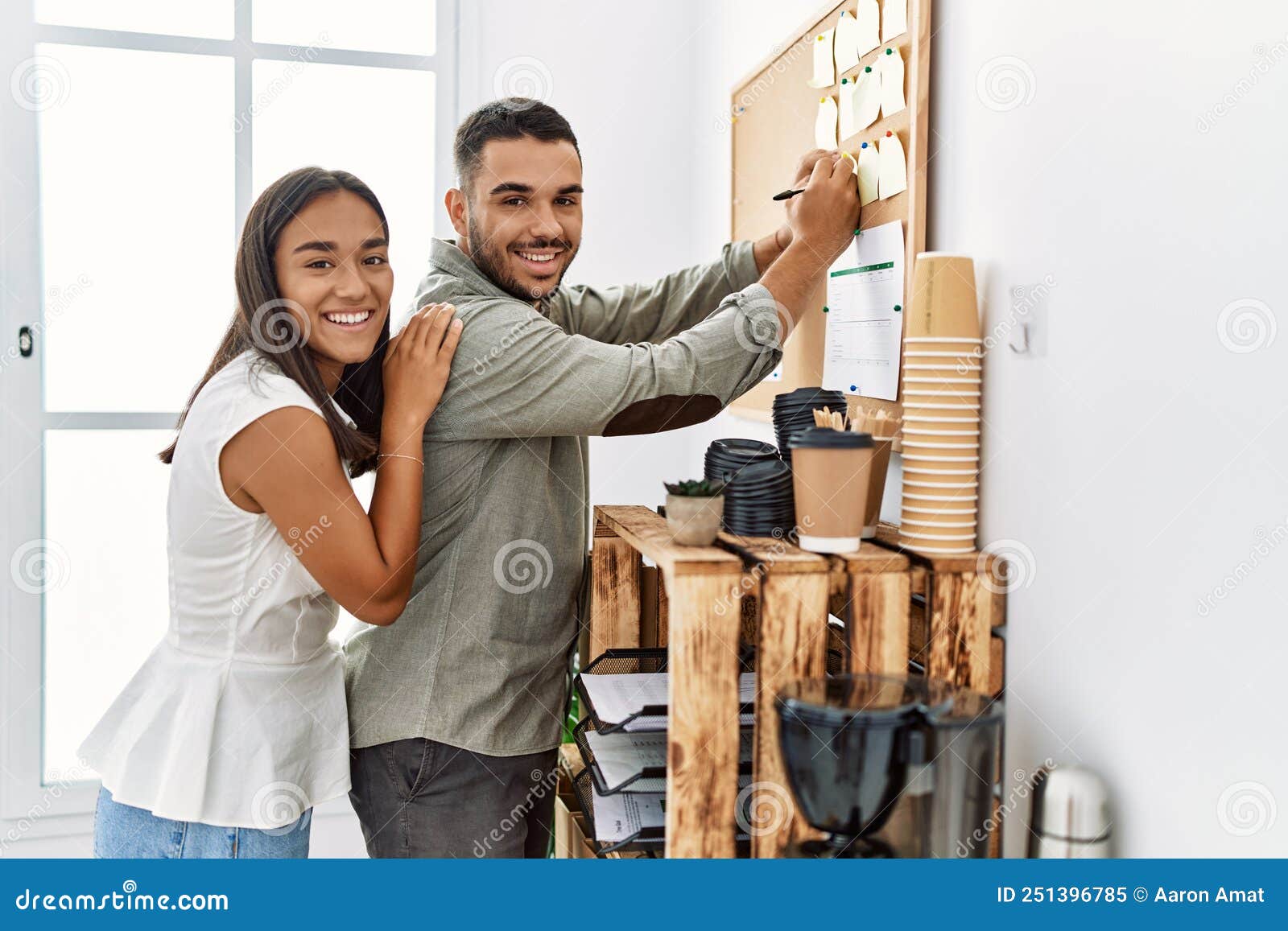 Two Latin Business Workers Smiling Happy Writing on Corkboard Working ...