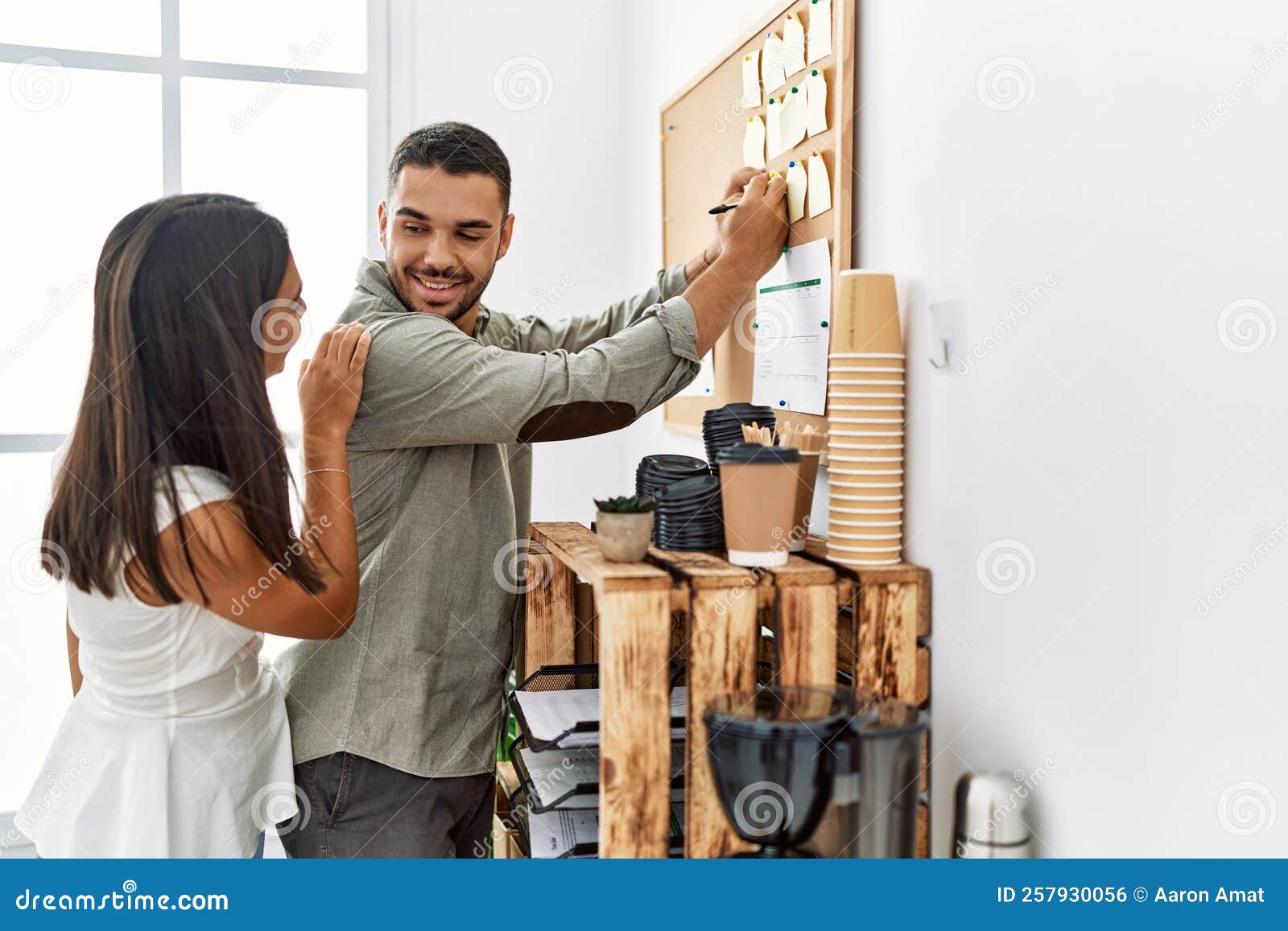 Two Latin Business Workers Smiling Happy Writing on Corkboard Working ...