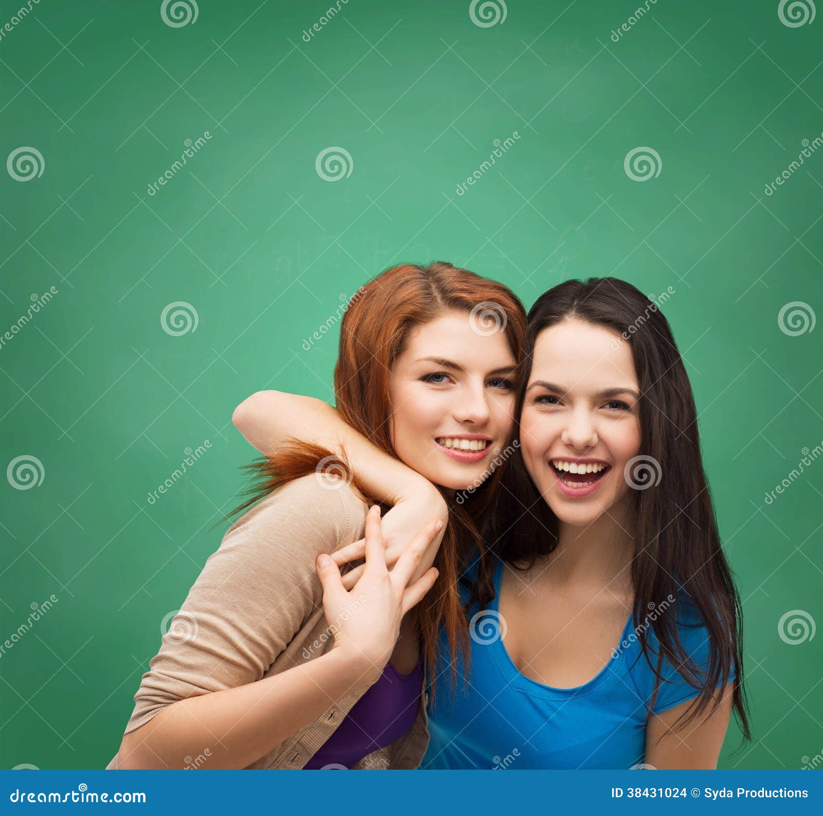 Two laughing girls hugging stock photo. Image of emotion - 38431024