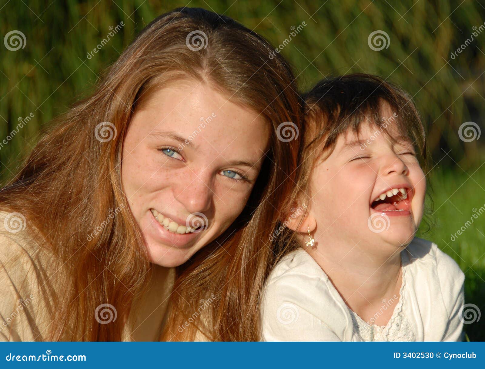 Two laughing sisters stock photo. Image of famaily, sister - 3402530