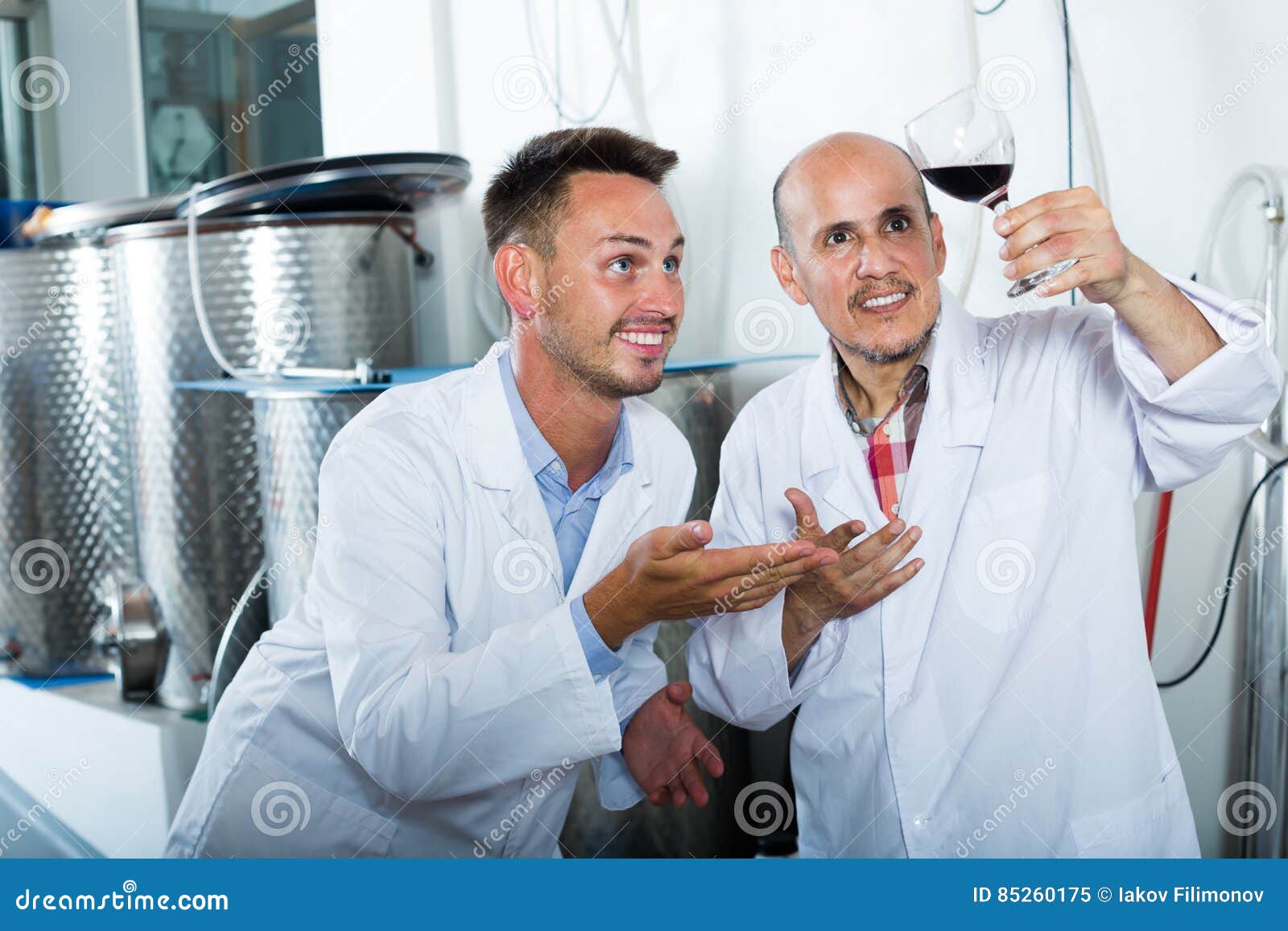 Two Laughing Workers Standing with Glass of Wine Stock Image - Image of ...