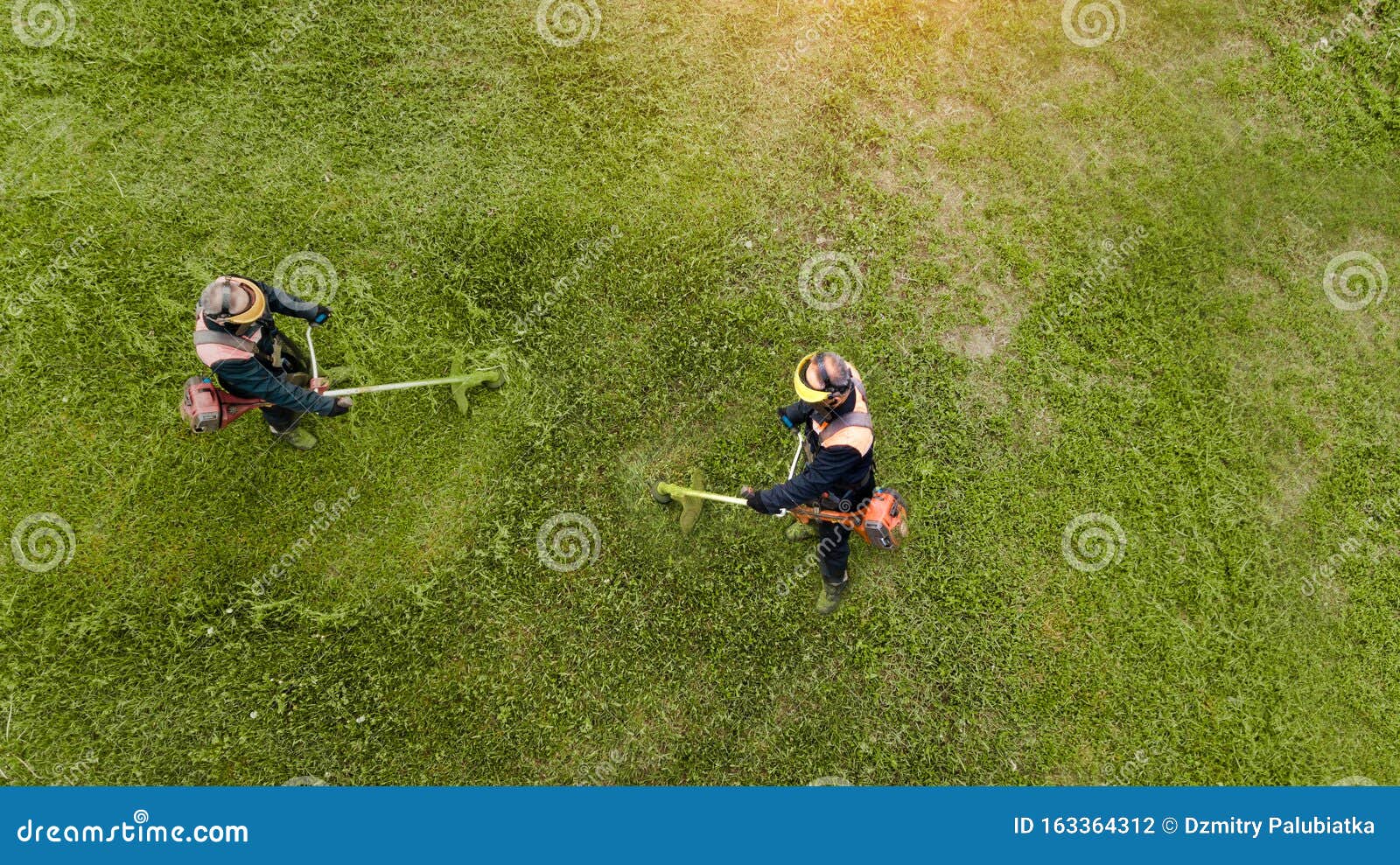 Two Lawn Mowers Mow Grass from a Drone Top View Stock Photo - Image of ...