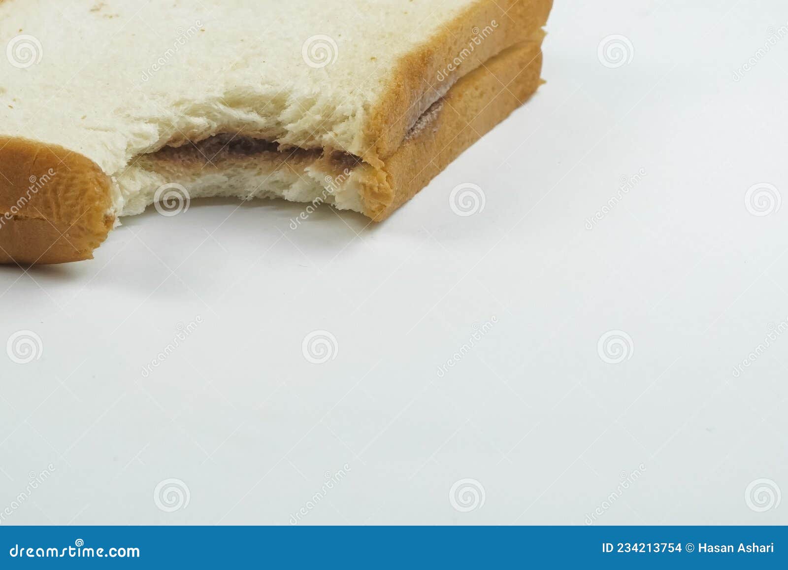 Two Layers of White Bread with Bite Marks on a White Background Stock ...