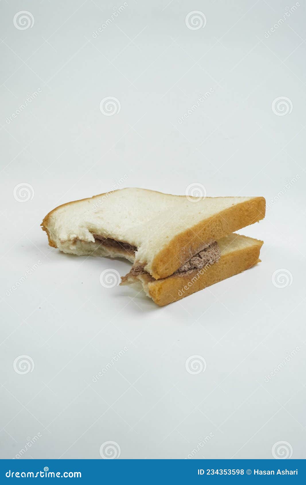 Two Layers of White Bread with Bite Marks on a White Background Stock ...