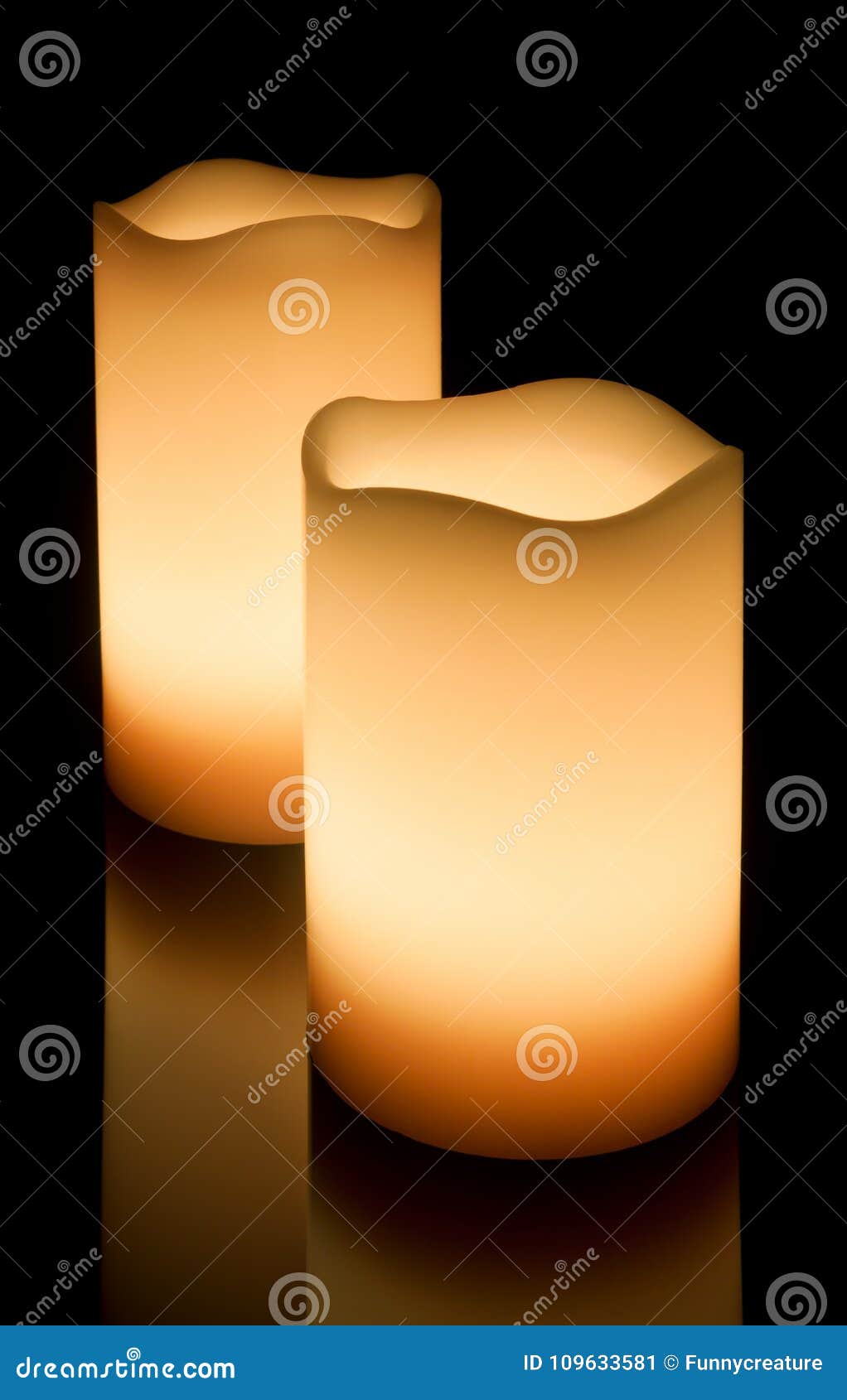 Two LED Candles on a Reflective Surface Stock Image - Image of ...