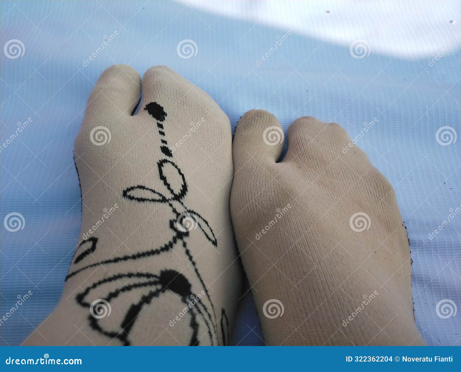 Two Left Feet Wearing Socks. Stock Photo - Image of nail, socks: 322362204