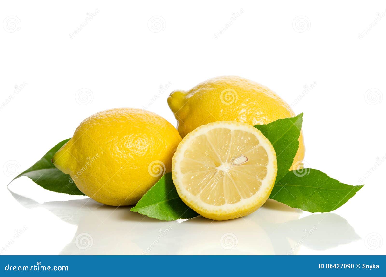 Two Lemons and Half with Leaves Stock Photo - Image of colorful, nature ...