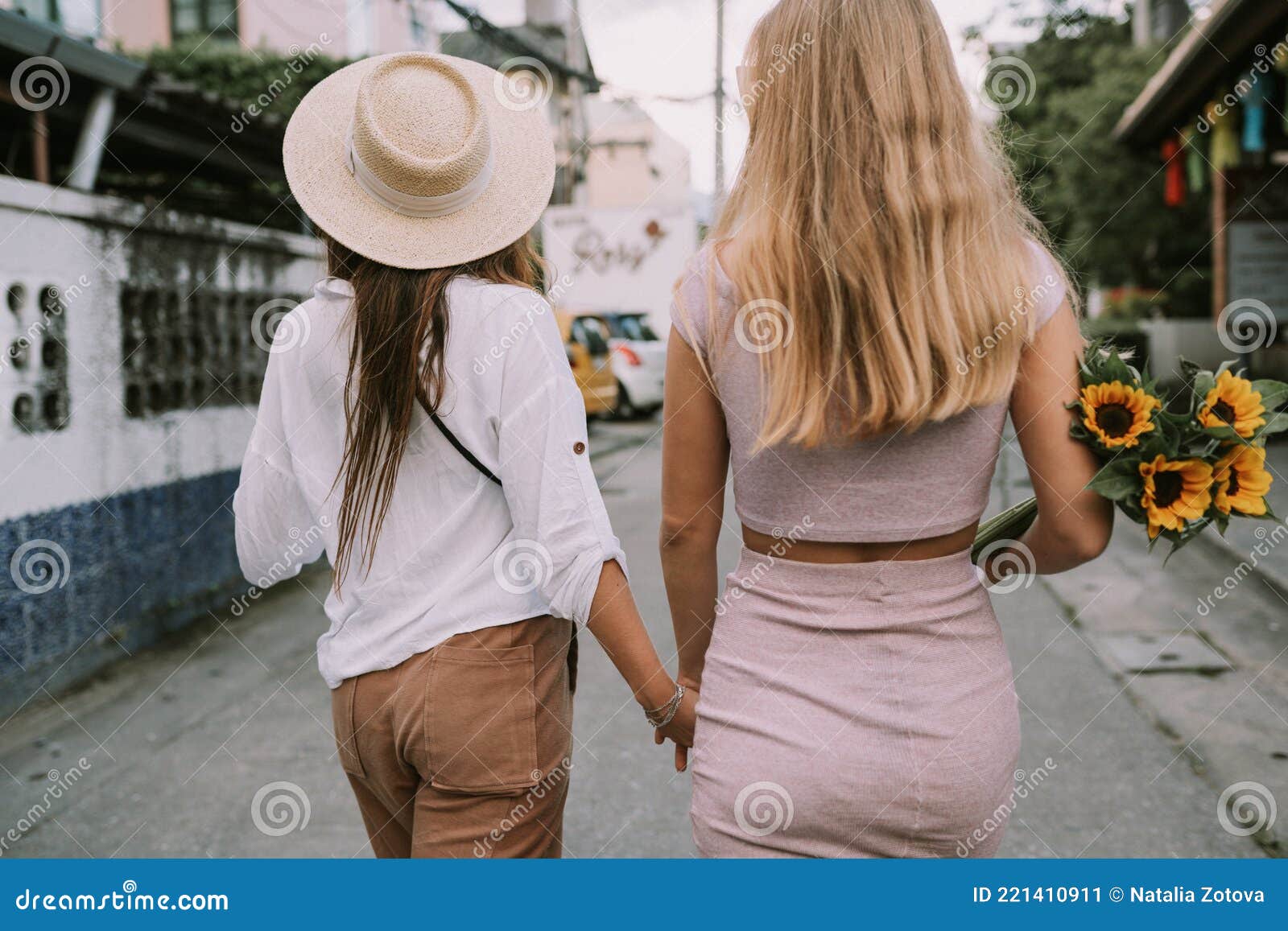 Two Lesbians Walking Down the Street Holding Hands Stock Image - Image ...