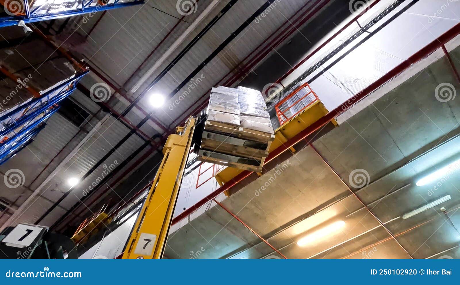 Two Level Warehouse. the Forklift Picks Up a Pallet from the Second ...