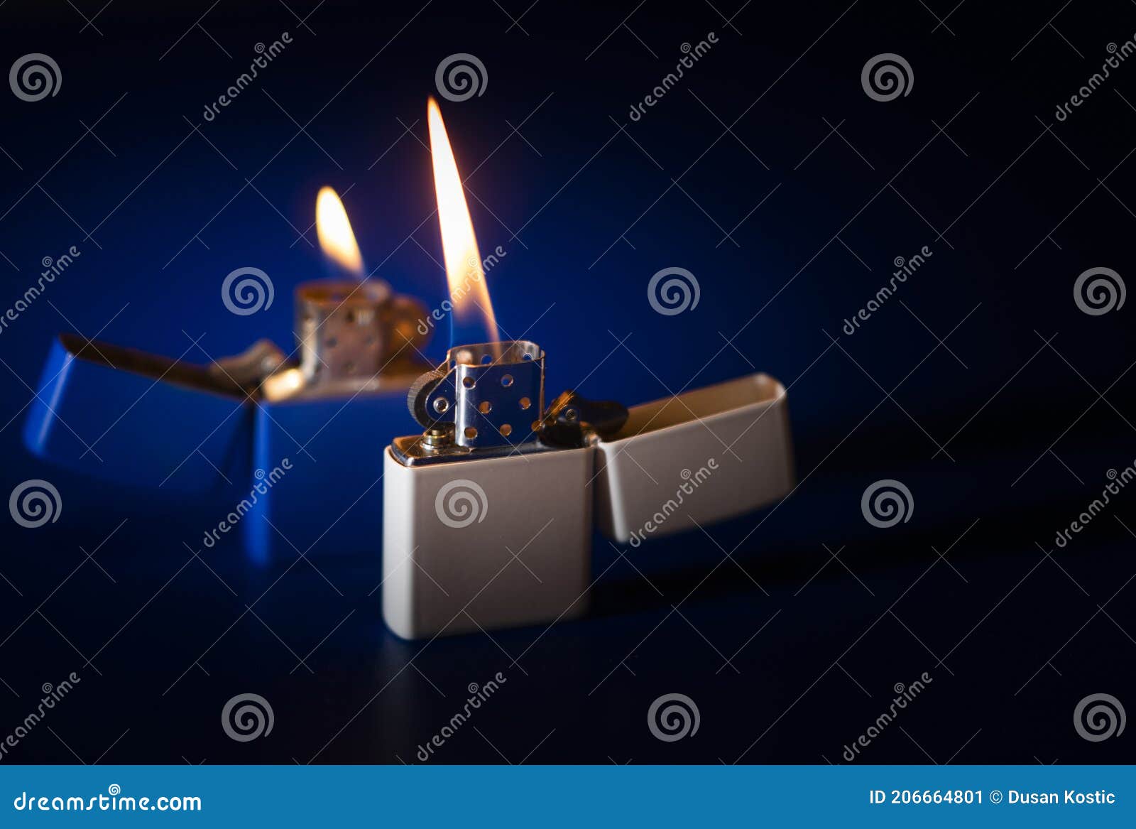 Two lighters fire closeup stock image. Image of flame - 206664801