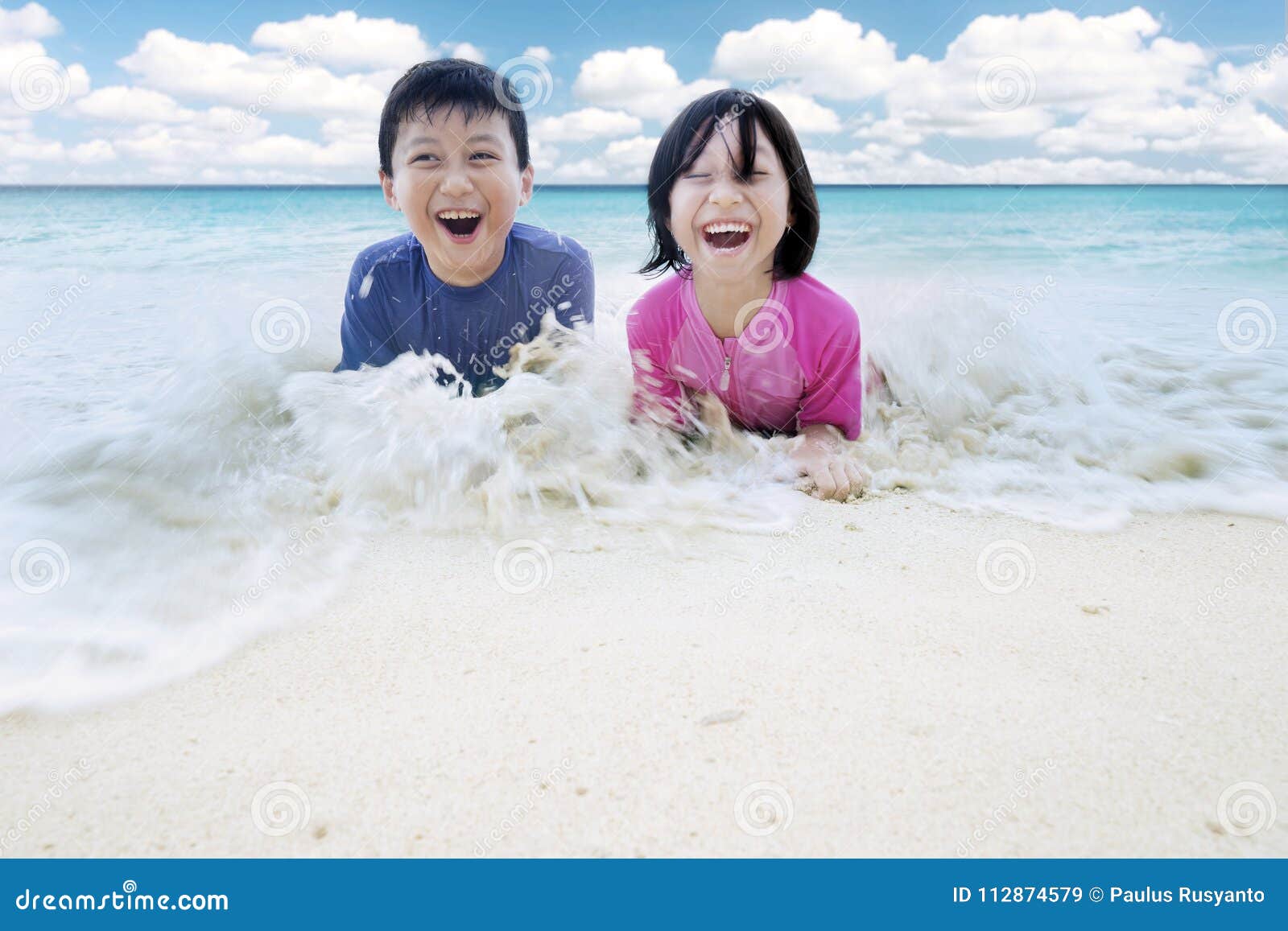 Two Little Children Playing Waves on Beach Stock Image - Image of ...