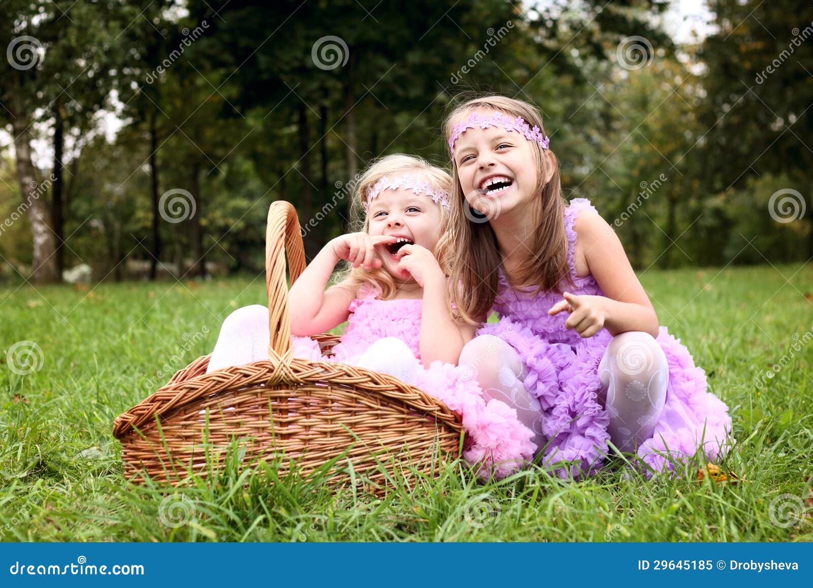 Two Little Cute Girlfriend in Beautiful Dresses are Laughing in the Sum ...