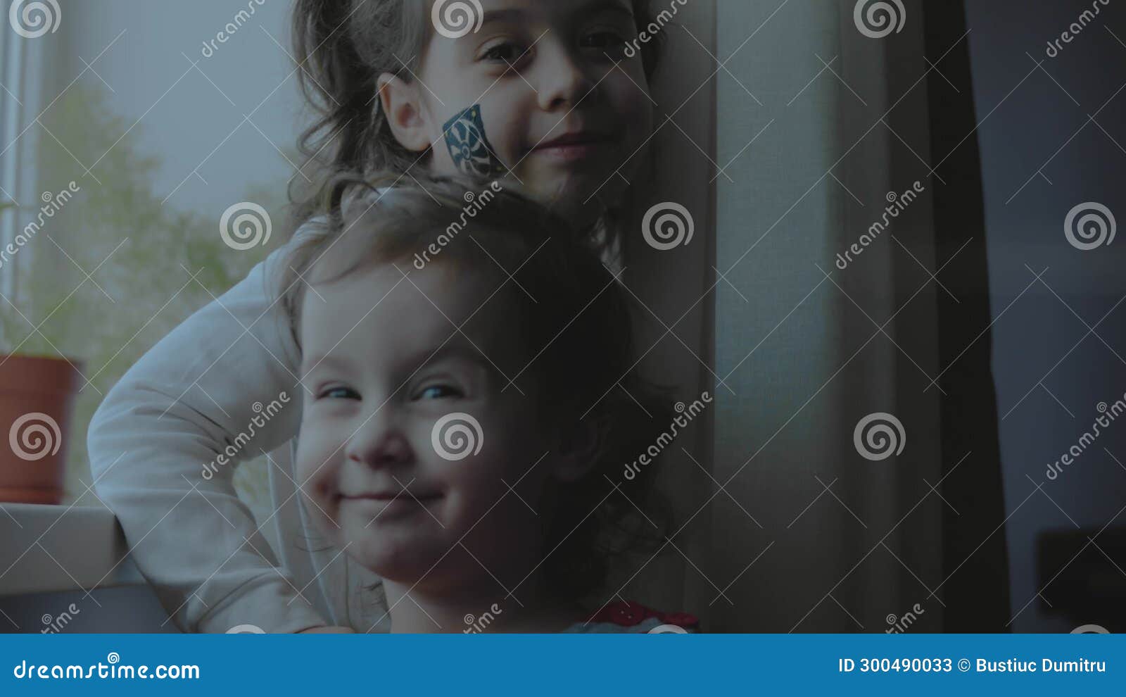 Two Little Girls with Computer Components Paintings on Their Faces ...