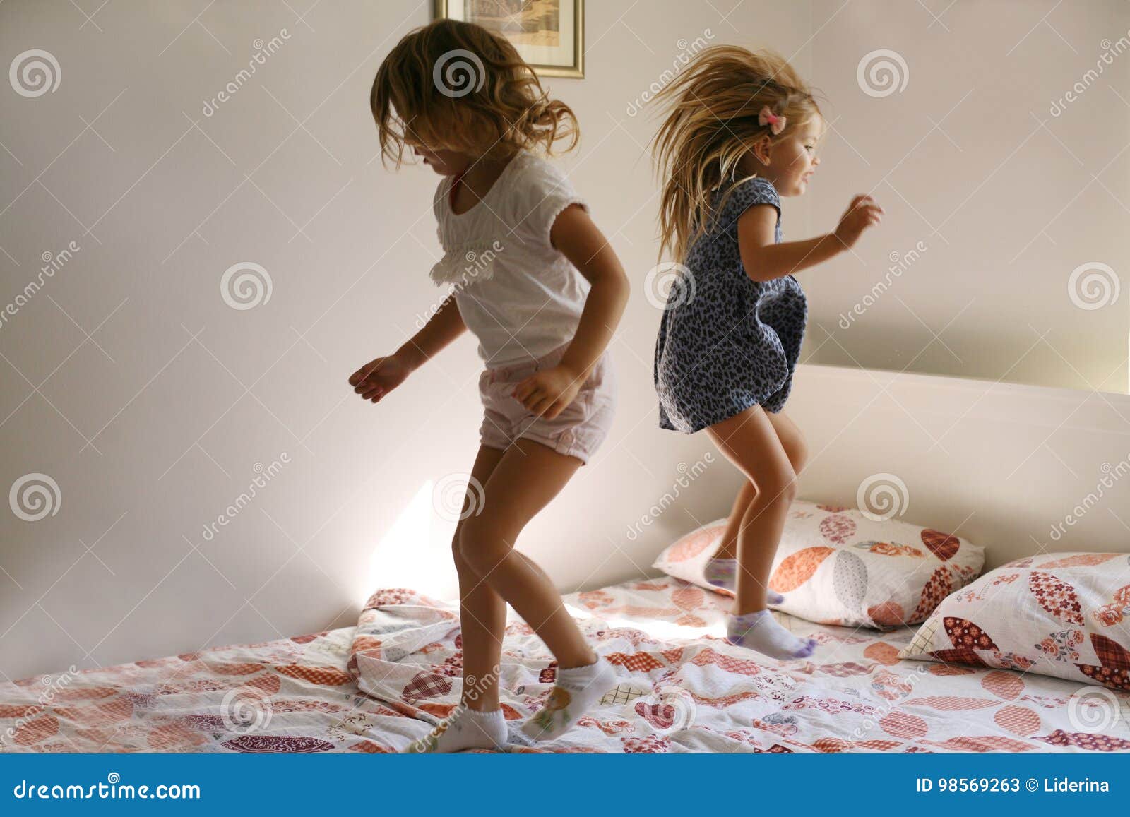 Two Little Girls Jumping in the Bed. Stock Image - Image of childhood ...