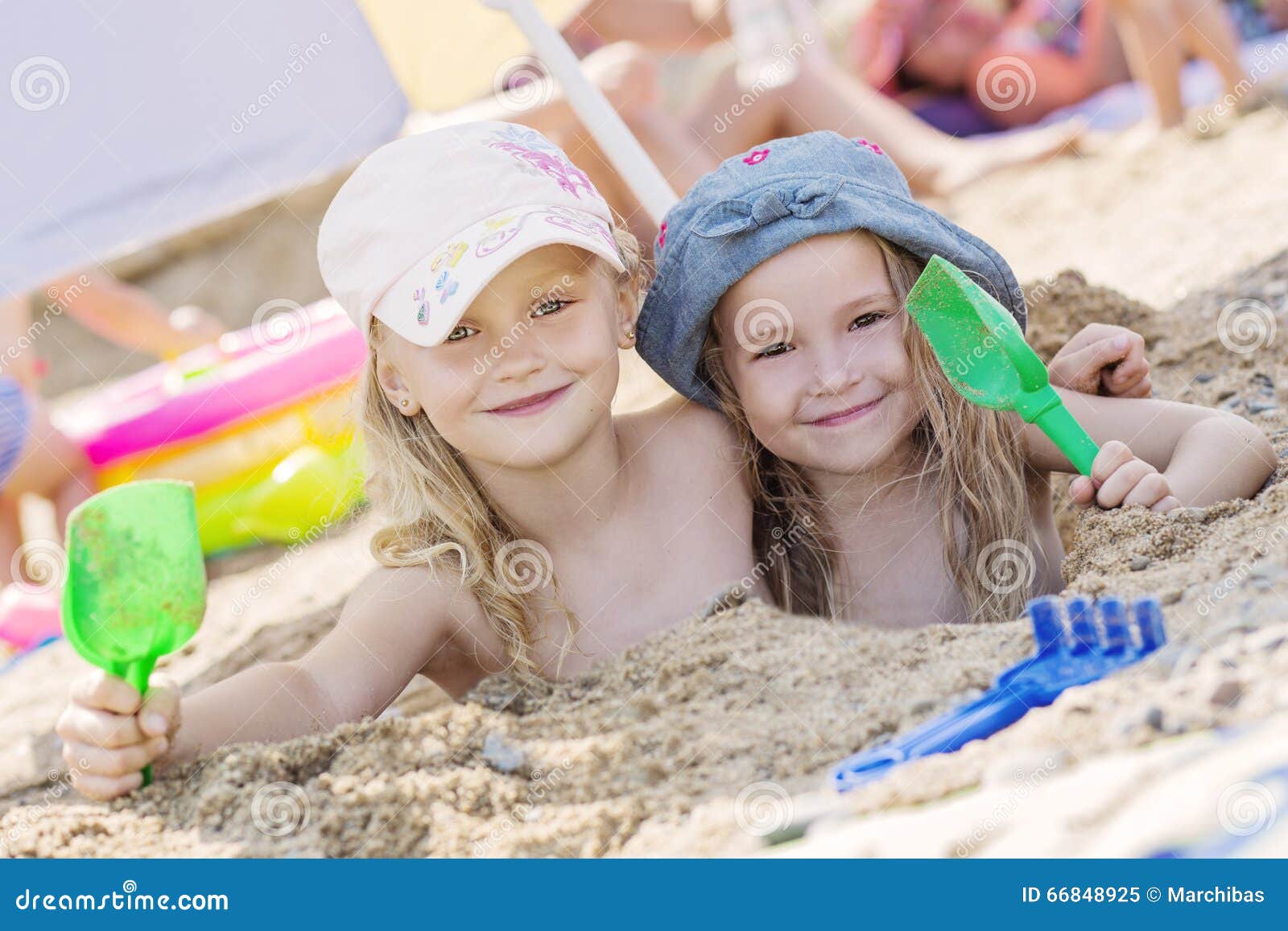 Two Little Girls Playing in the Sand Stock Image - Image of beautiful ...