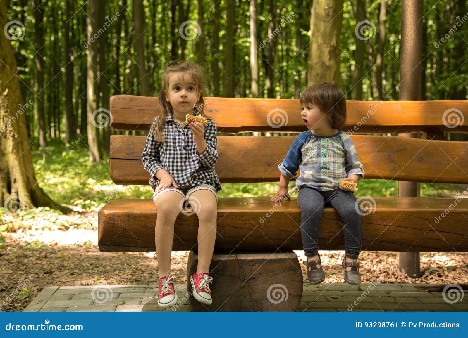 Two Little Girls Sit on the Bench Stock Image - Image of family, lake ...