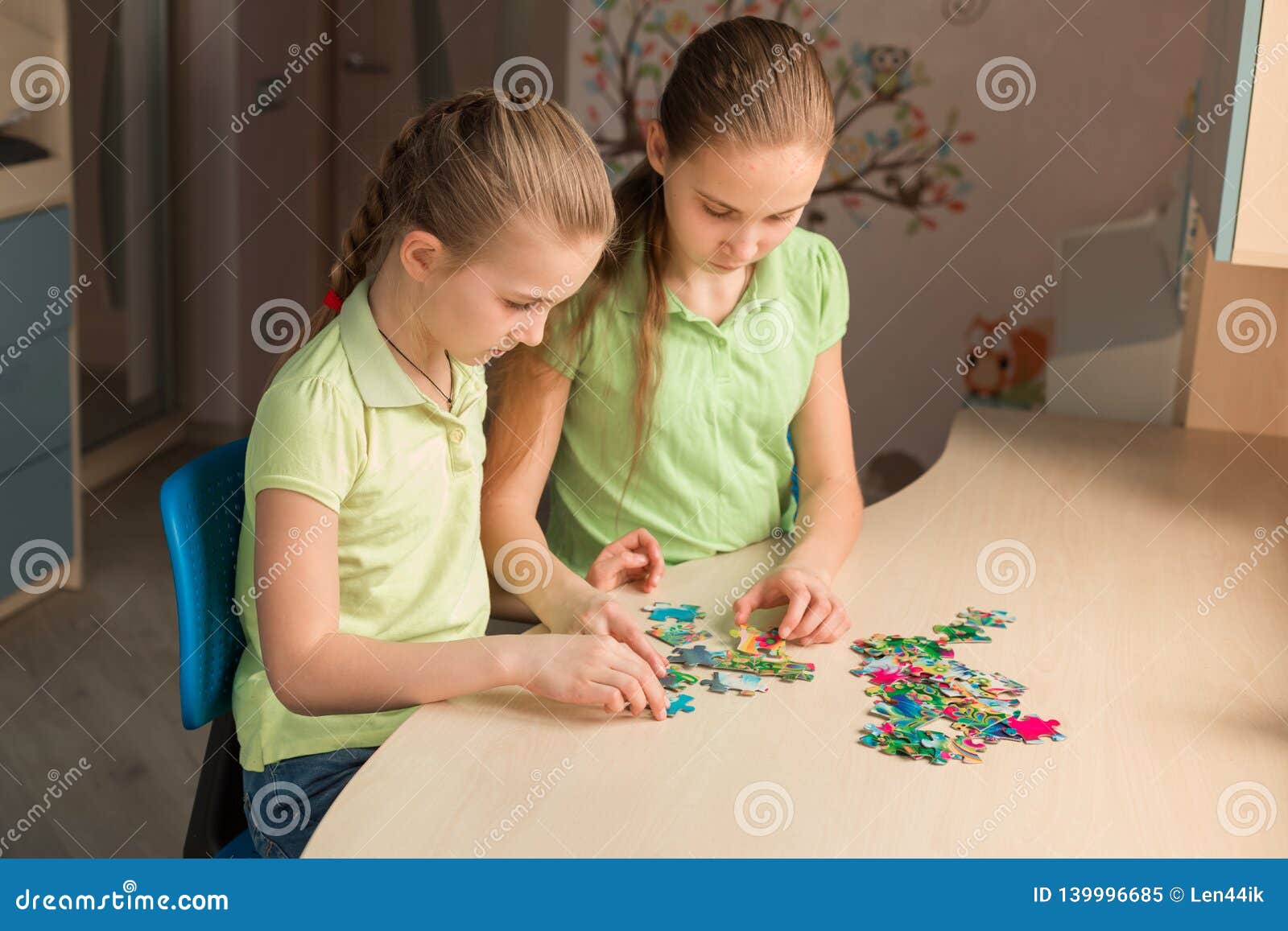 Two Little Girls Solving Puzzle Together Stock Image - Image of jigsaw ...