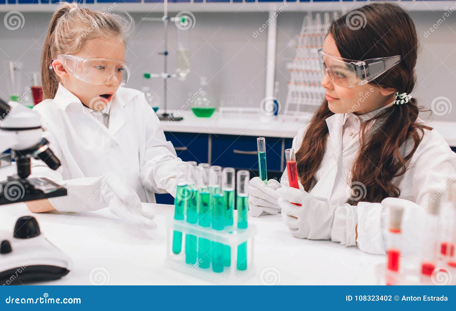 Two Little Kids in Lab Coat Learning Chemistry in School Laboratory ...