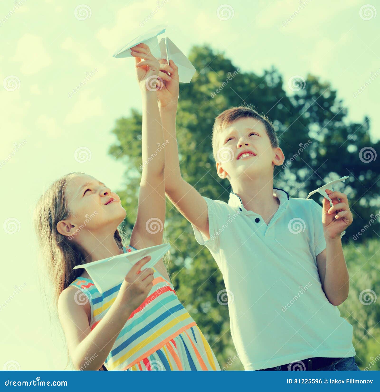 Two Little Kids Playing with Simple Paper Planes Stock Photo - Image of ...