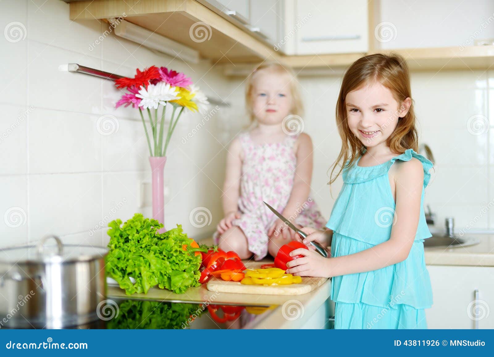Two Little Sisters Cooking Dinner Stock Photo - Image of love, meal ...