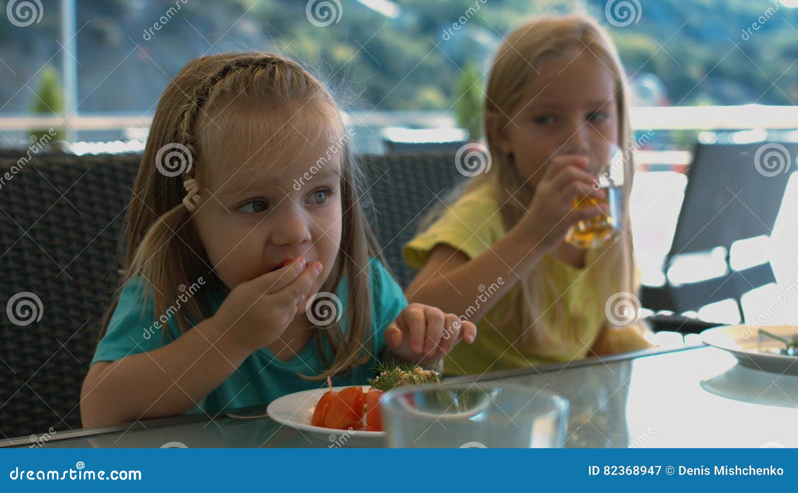 Two Little Sisters Eating in the Cafe Stock Image - Image of cafe ...