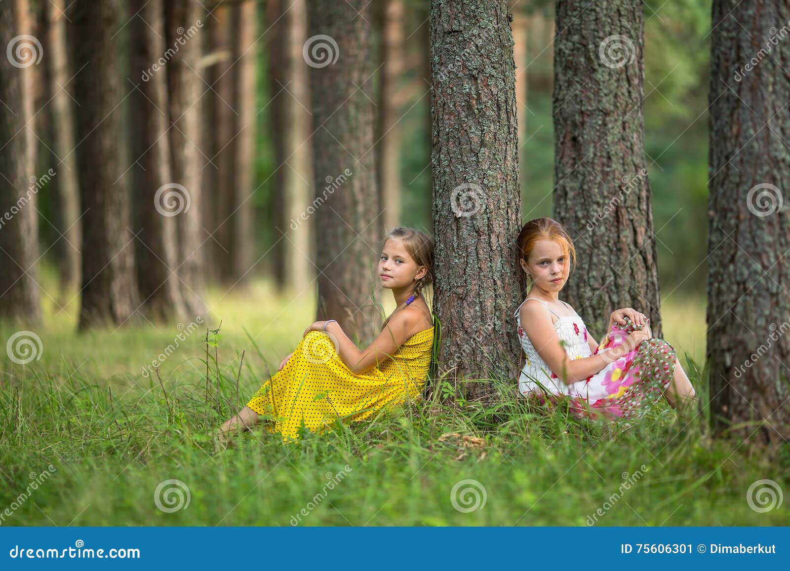 Two Little Sisters Sitting in a Pine Forest. Nature. Stock Image ...