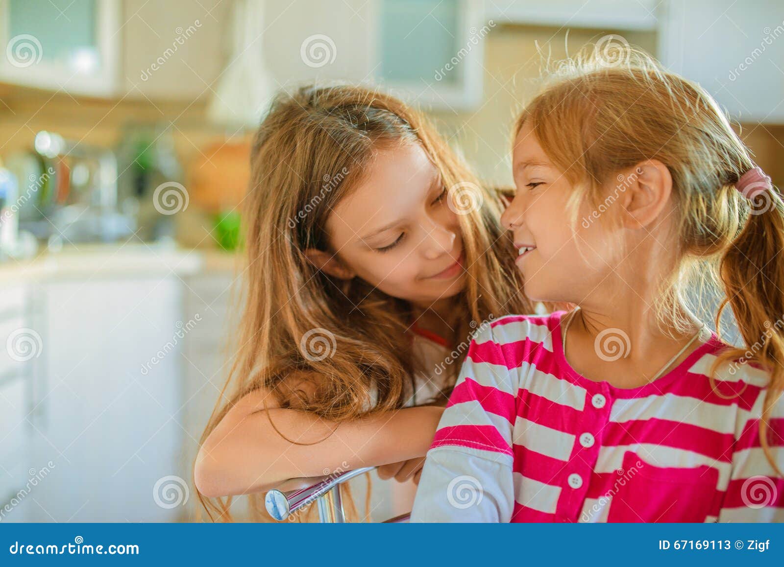 Two little sisters smiling stock image. Image of happy - 67169113