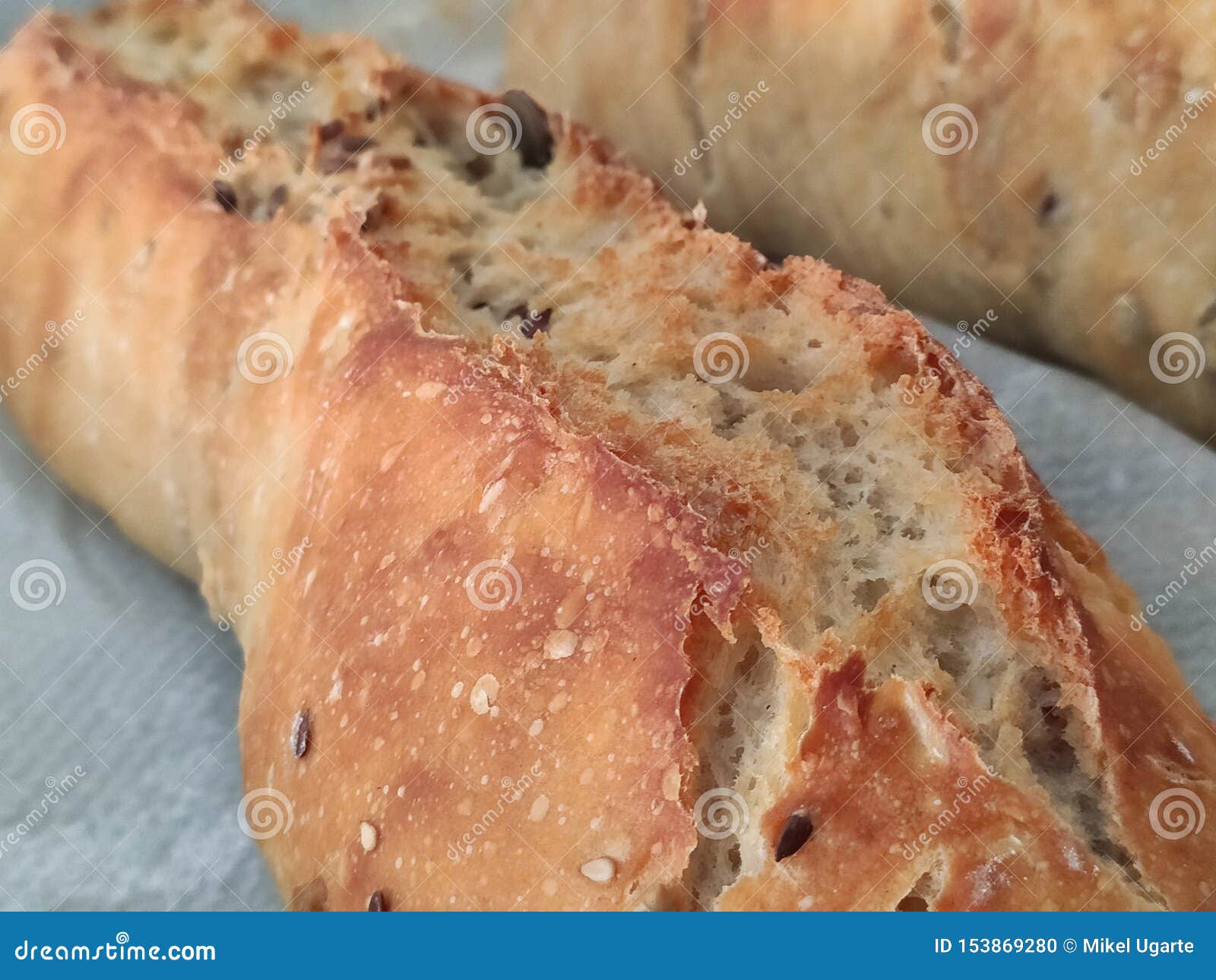 Two Loaves of Bread Right from the Oven Stock Photo - Image of seeds ...