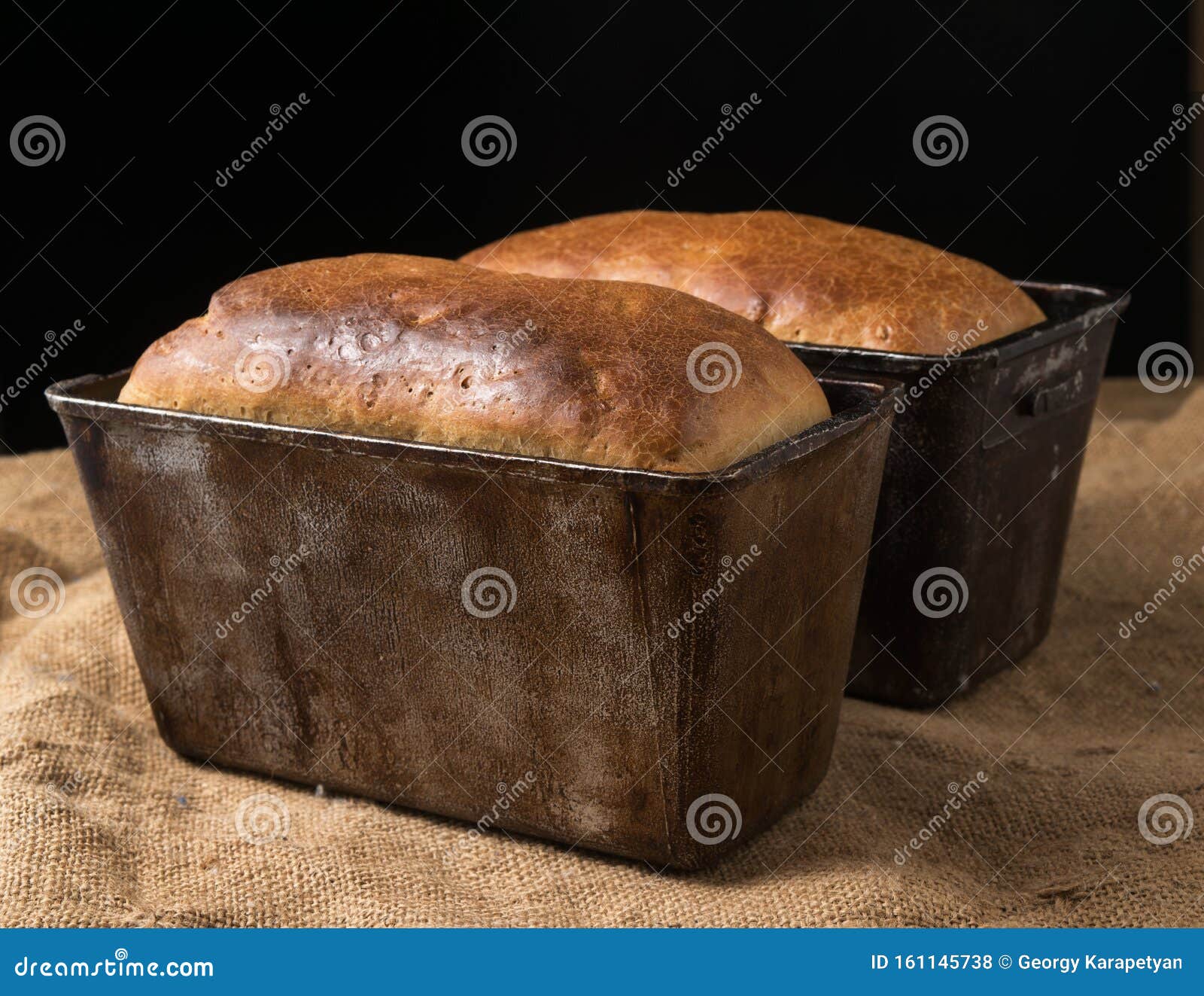 Two Loaves of White Bread in a Baking Dish Stock Photo - Image of ...