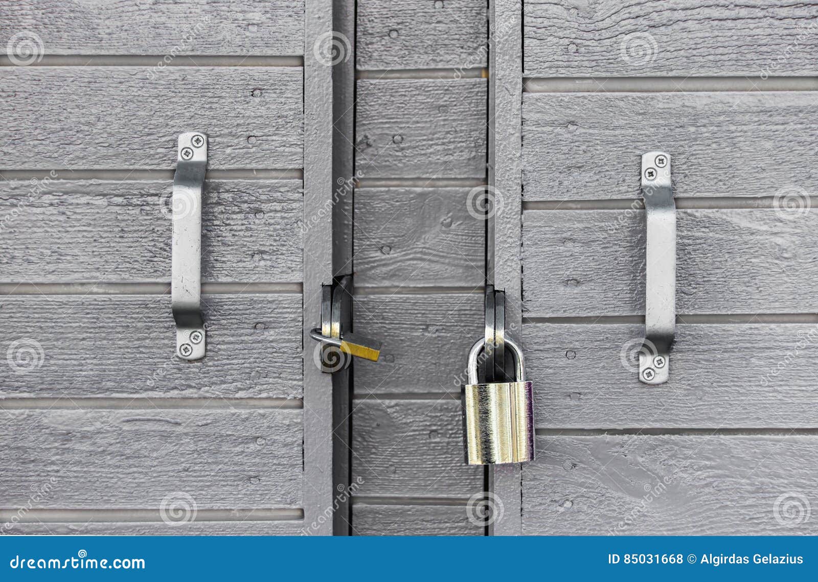 Two Locks on a Wooden Grey Door Stock Photo - Image of close, design ...