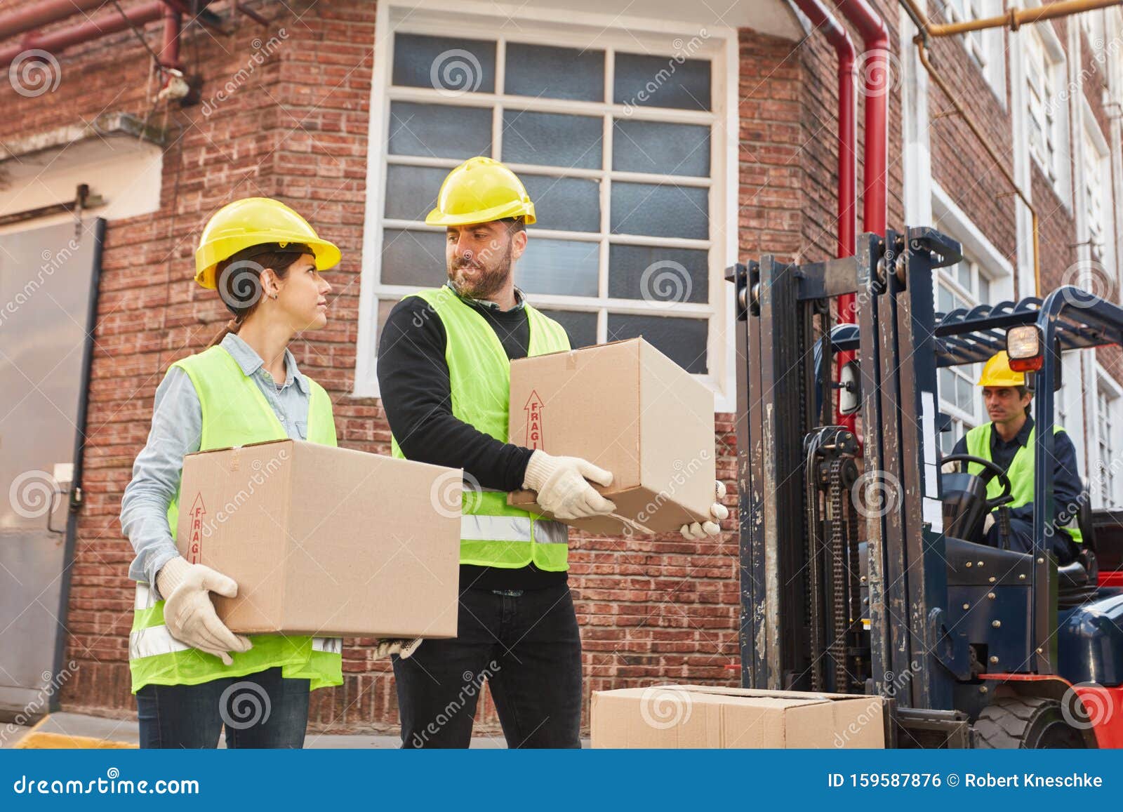 Logistics Worker in Front of Depot with Package Delivery Stock Photo ...