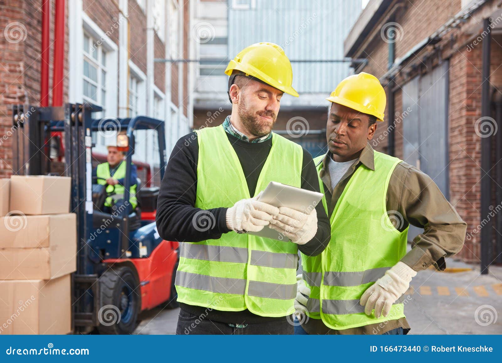 Two Logistics Workers with Tablet Pc Stock Photo - Image of controlling ...