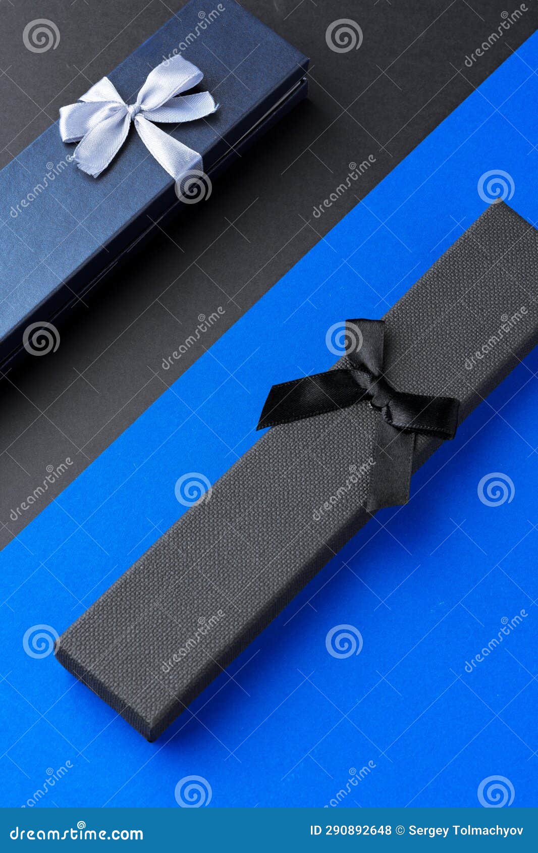 Two Long Jewelry Boxes on Black and Blue Background Stock Photo - Image ...