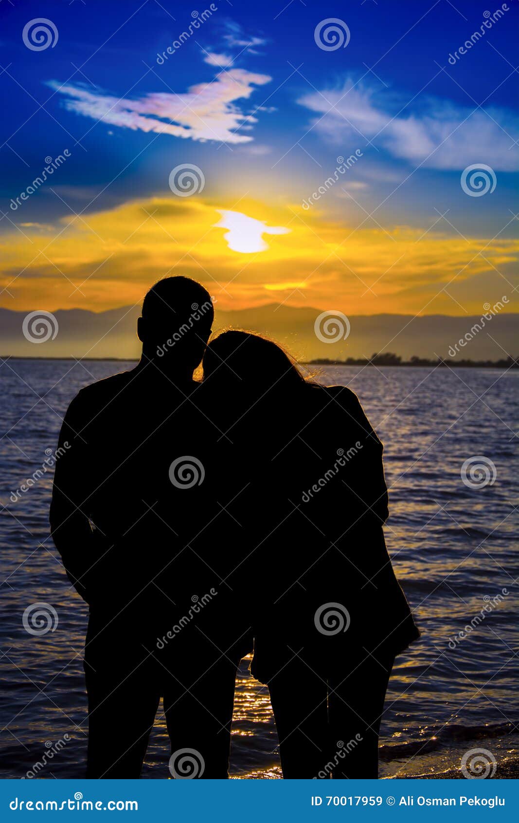Two lovers at sunset stock image. Image of girl, person - 70017959