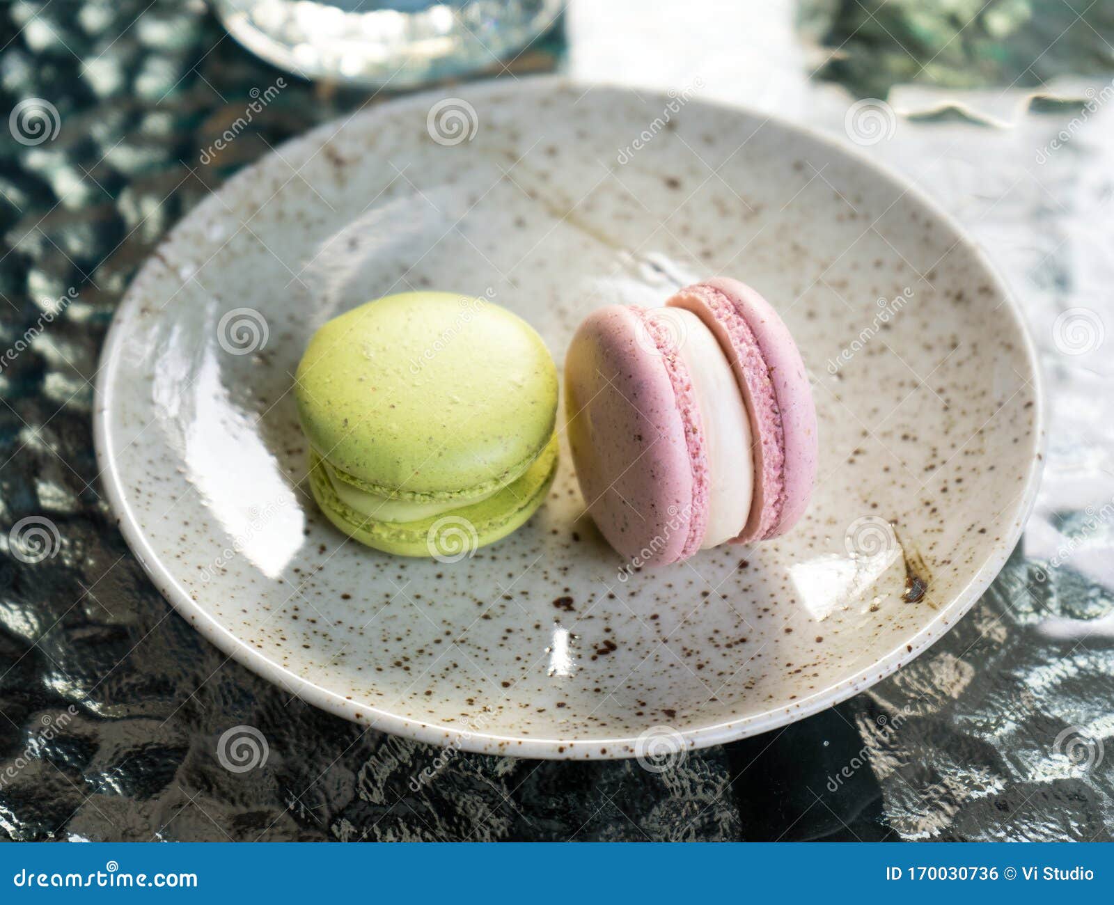 Two Macaroons in a Gray Plate. Lime and Pink Macaroon in a Plate ...