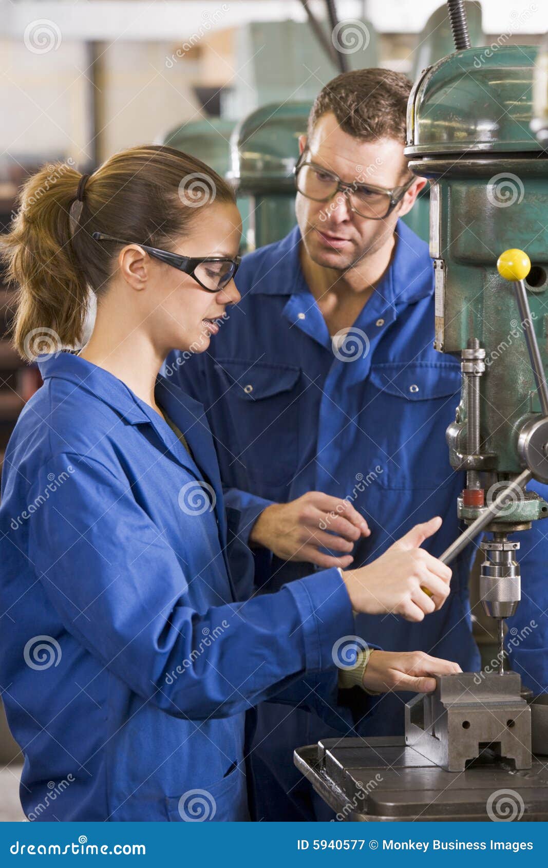 Two Machinists Working on Machine Stock Image - Image of blue, engineer ...