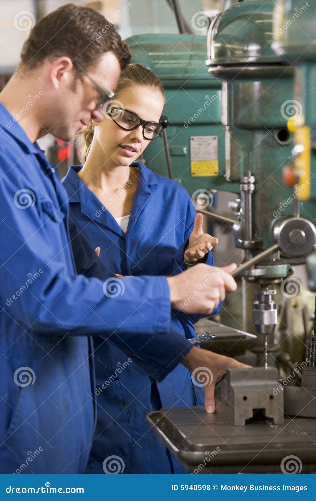 Two Machinists Working on Machine Stock Photo - Image of glasses ...