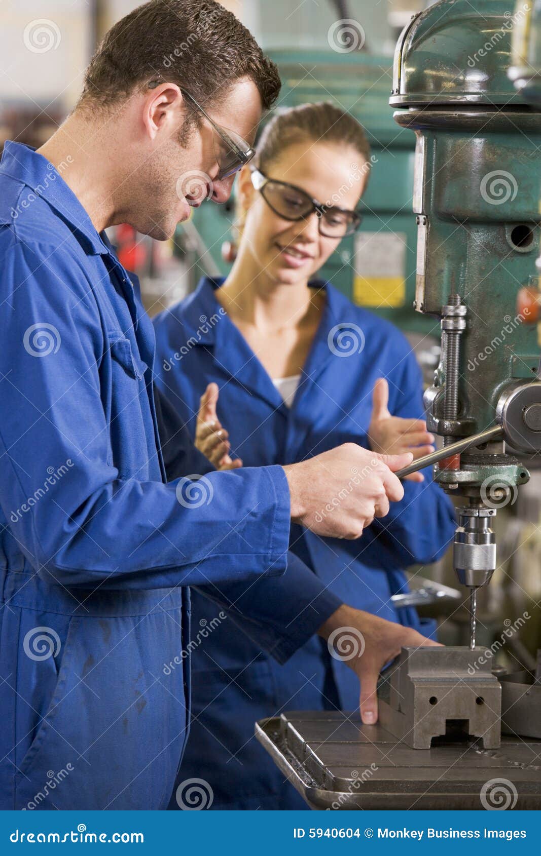 Two Machinists Working on Machine Stock Photo - Image of female ...