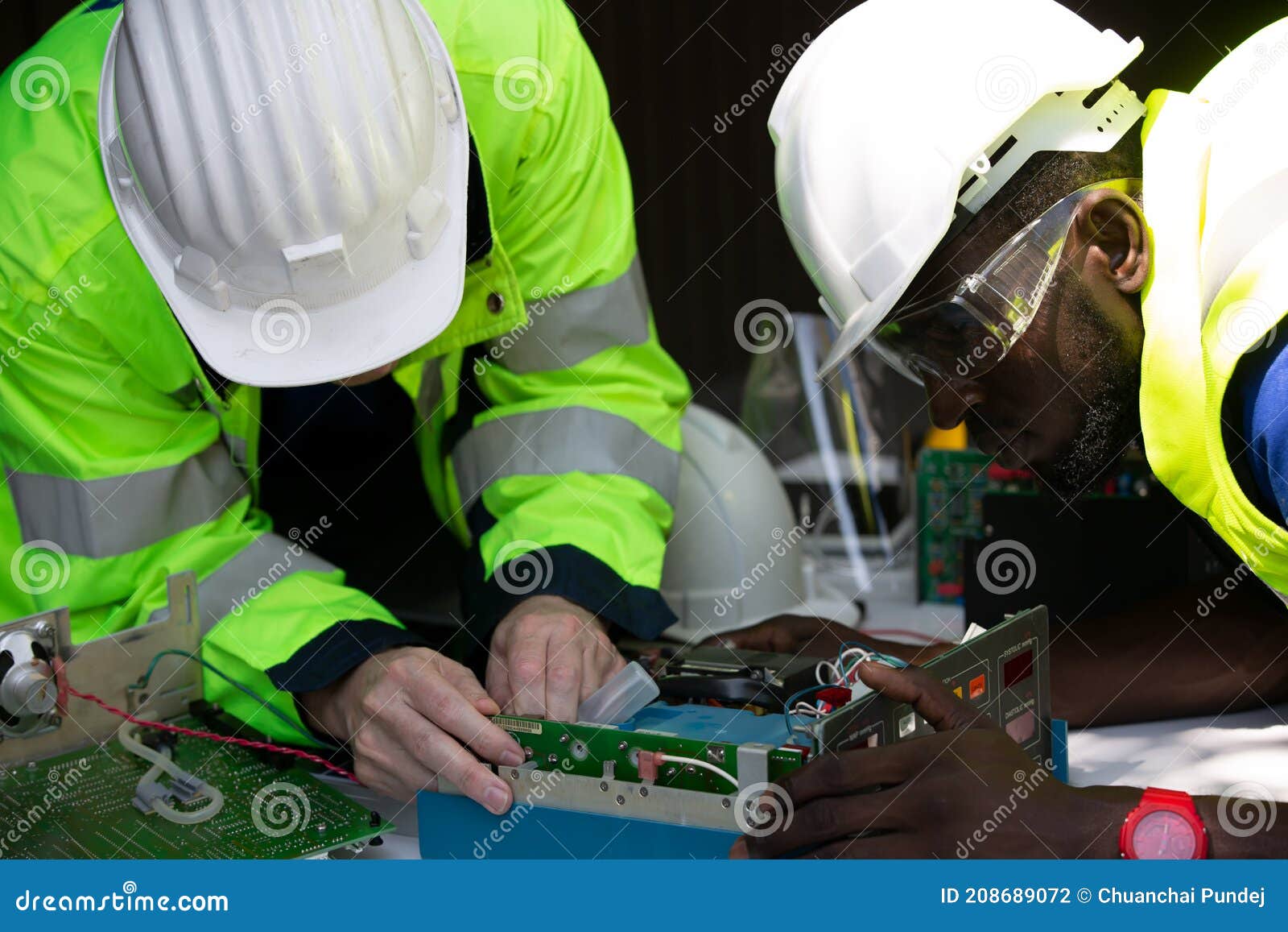 Two Maintenance Engineers Solar Energy Systems Engineer Perform ...