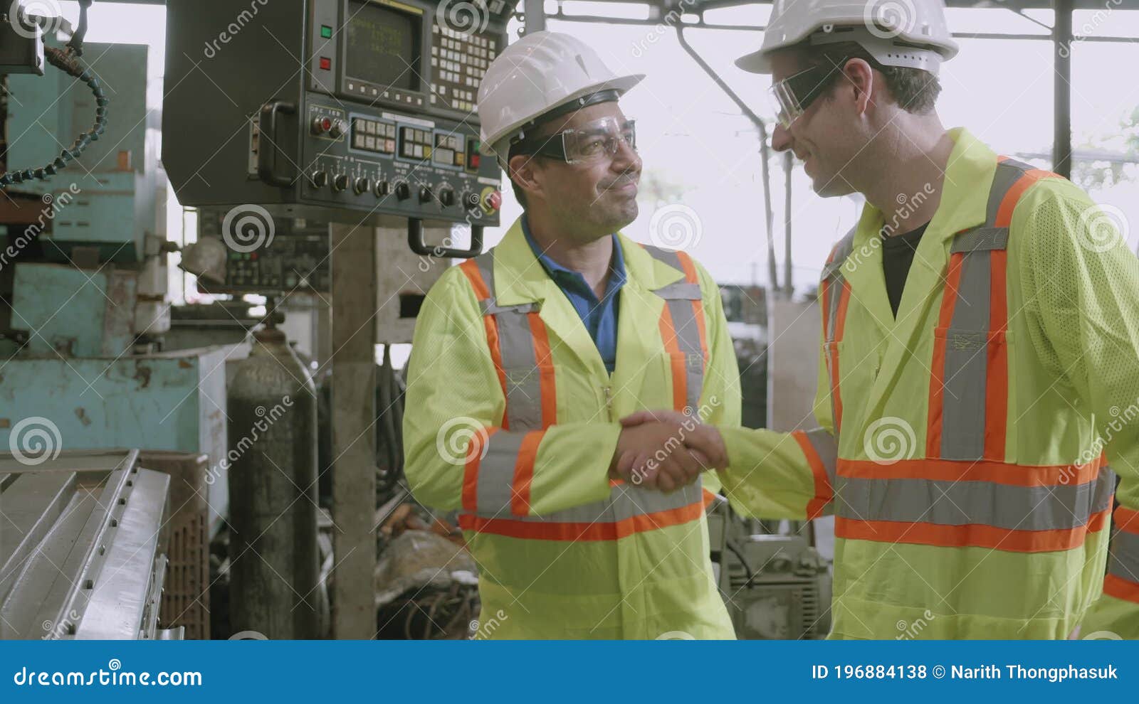Two Maintenance Man and Partner Work with System of Machine in ...