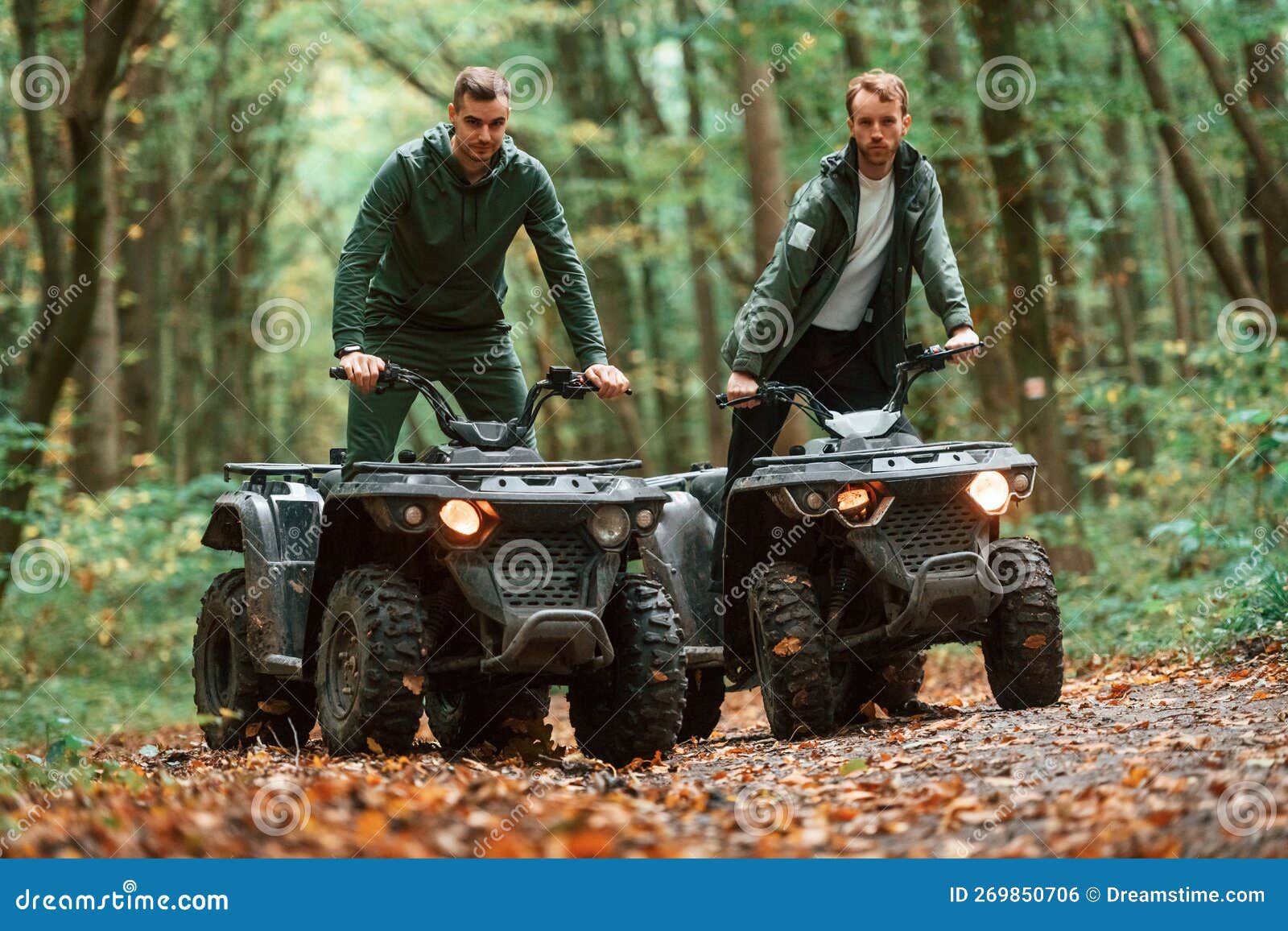 Two Male Atv Riders is in the Forest Together Stock Photo - Image of ...
