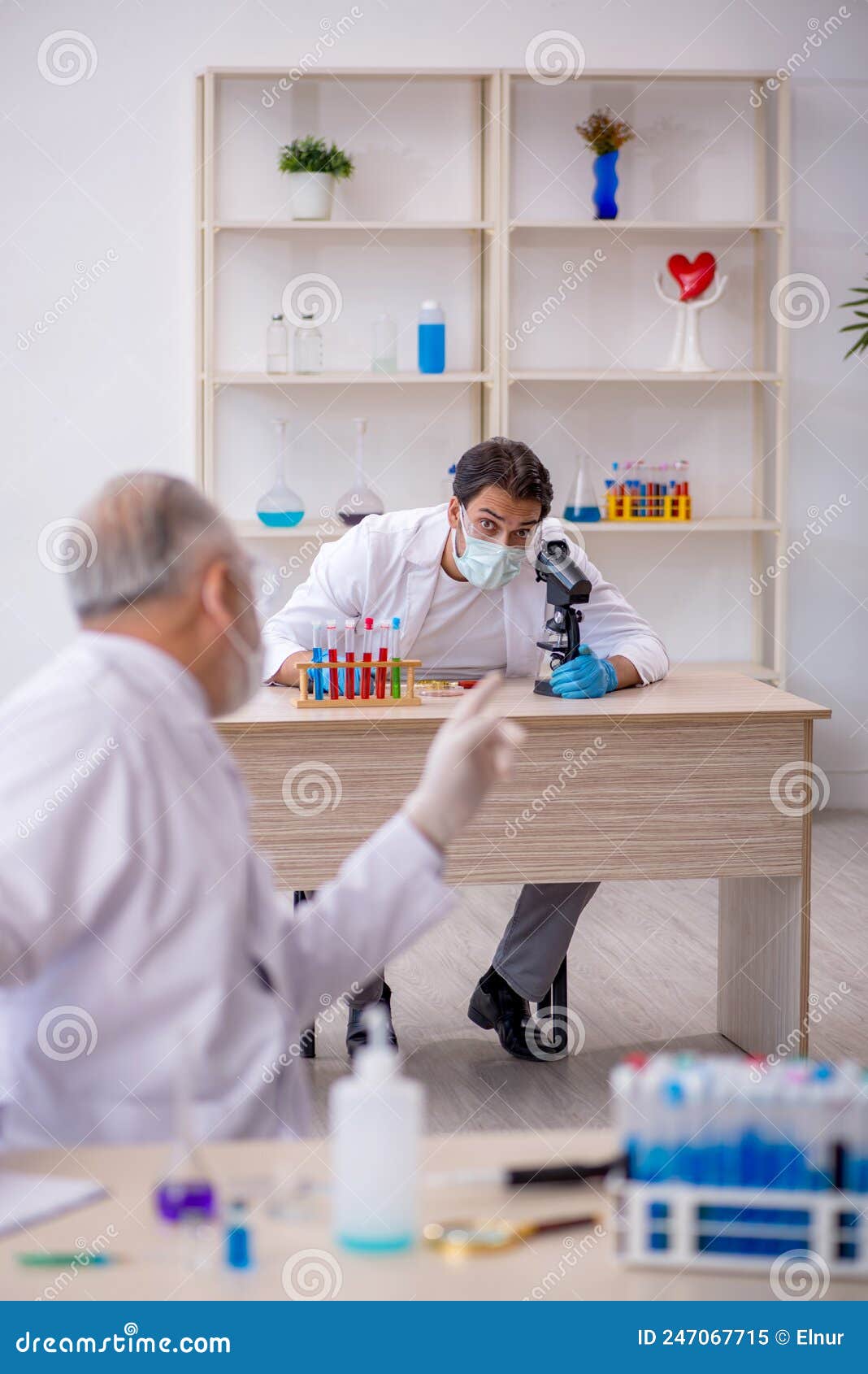 Two Male Chemist Working at the Lab Stock Image - Image of explaining ...