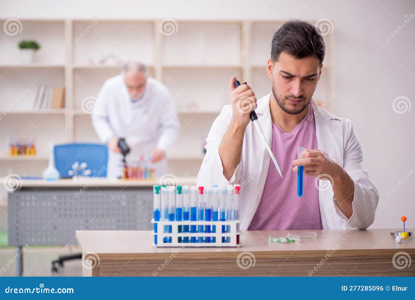 Two Male Chemists Working at the Lab Stock Photo - Image of solution ...