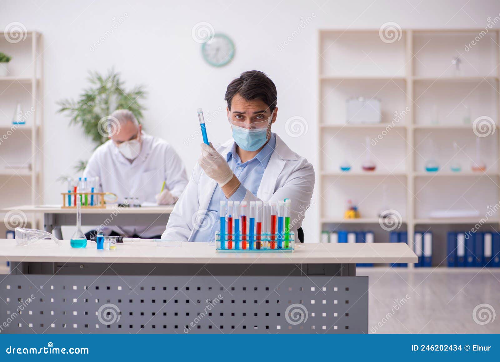 Two Male Chemists Working at the Lab during Pandemic Stock Photo ...