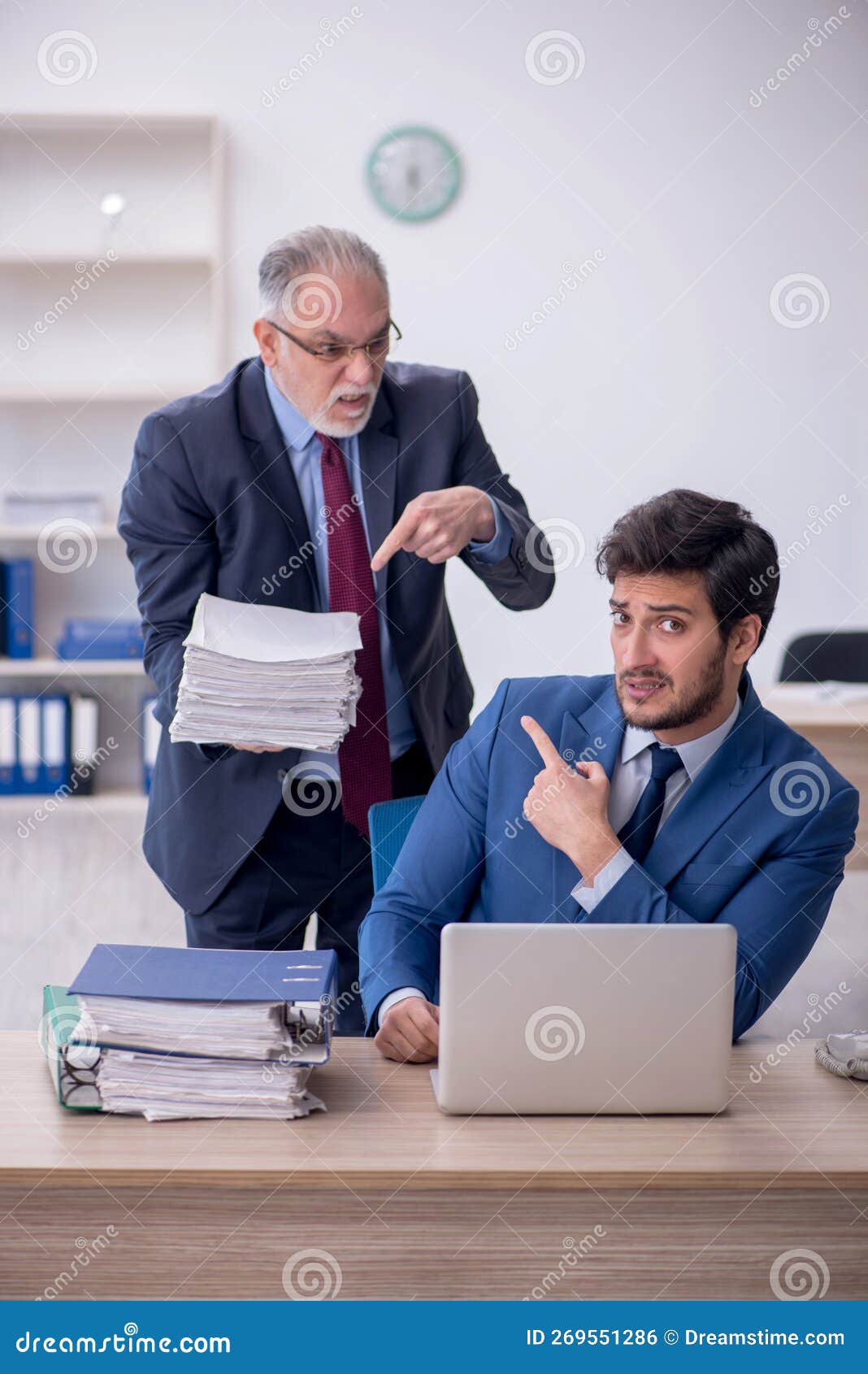 Two Male Colleagues Working in the Office Stock Photo - Image of paper ...