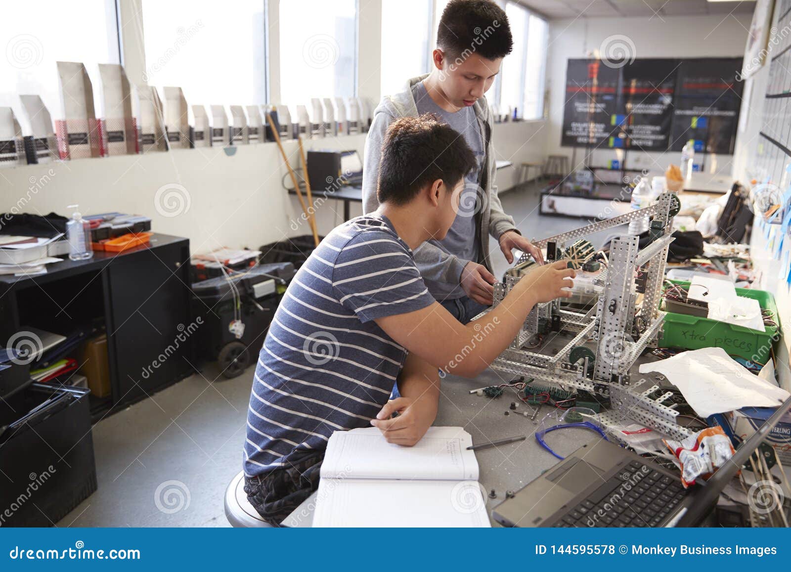 Two Male College Students Building Machine in Science Robotics or ...