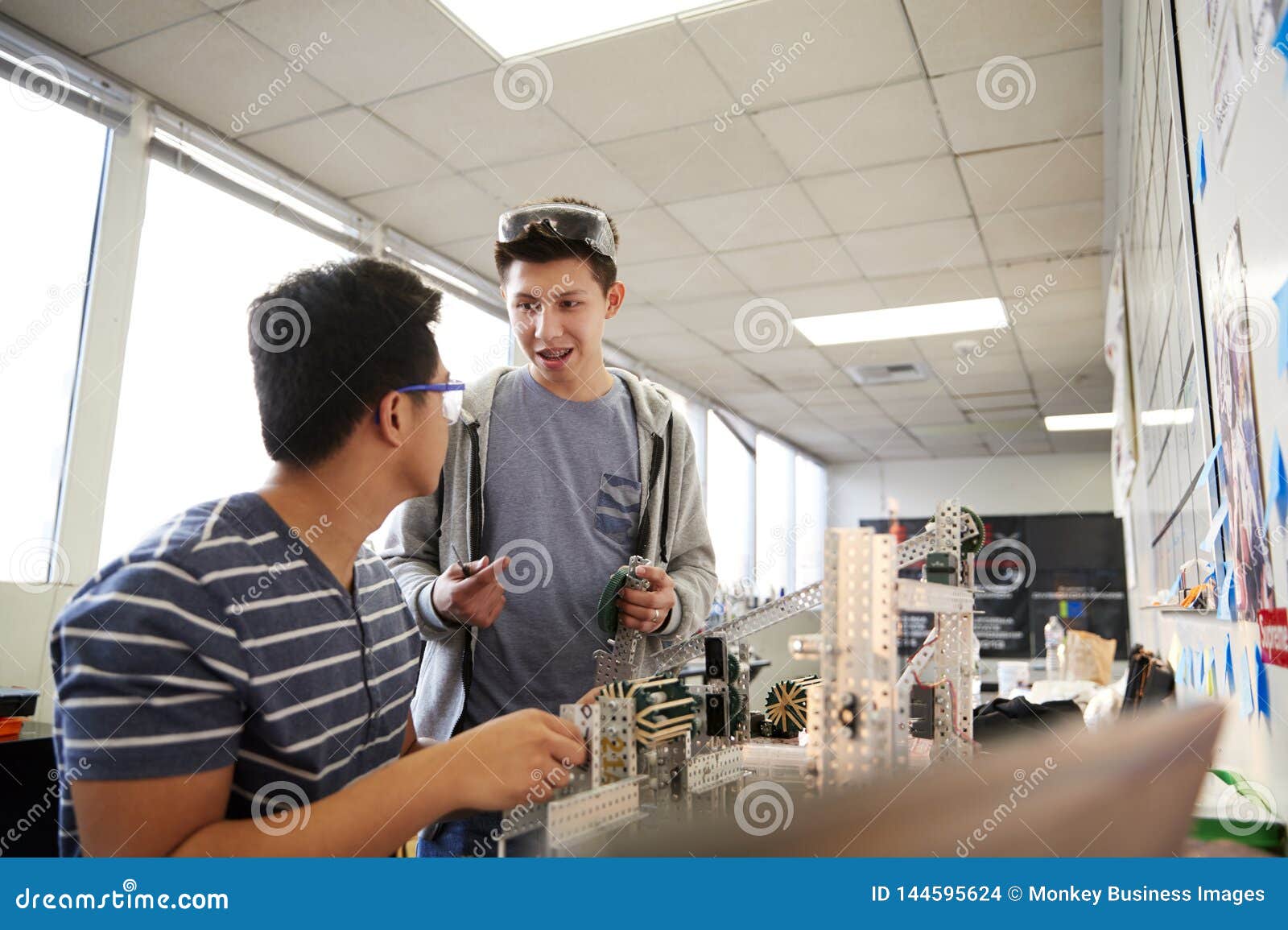 Two Male College Students Building Machine in Science Robotics or ...
