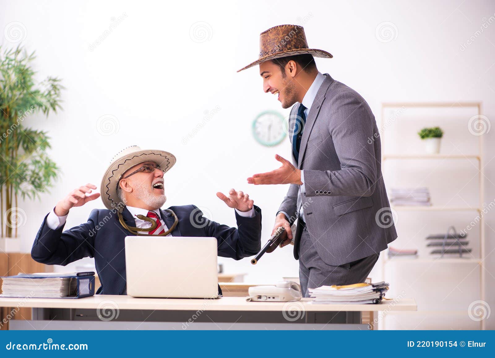 Two Male Cowboy Employees in Funny Concept Stock Photo - Image of ...