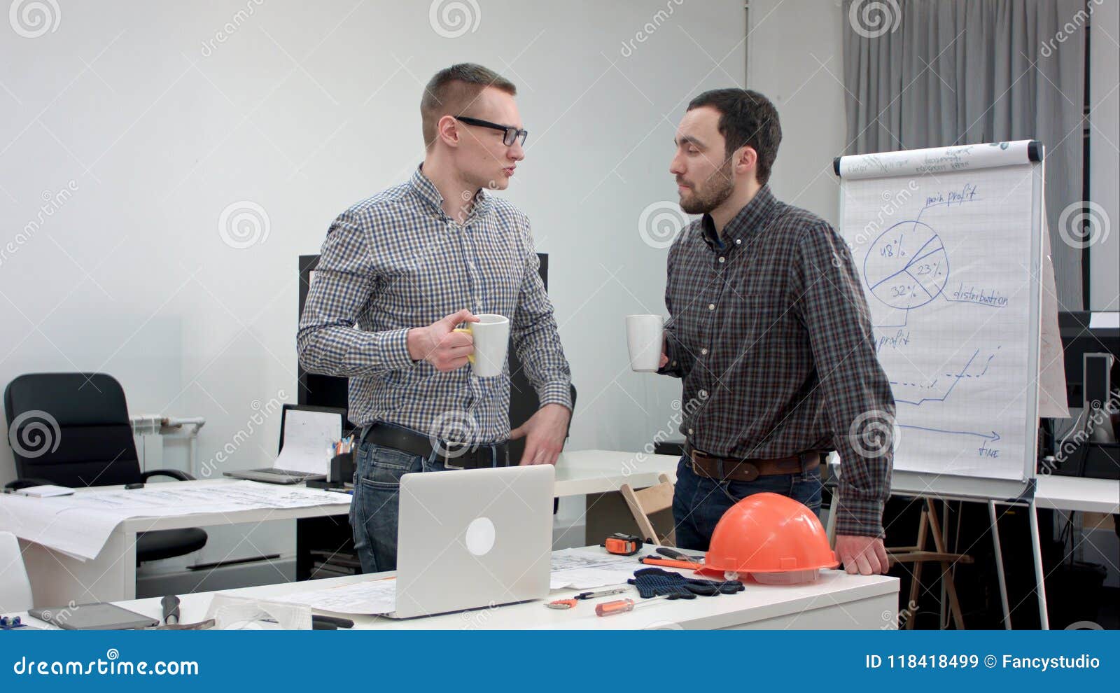 Two Male Coworkers Having Coffee Break and Talking in the Office Stock ...