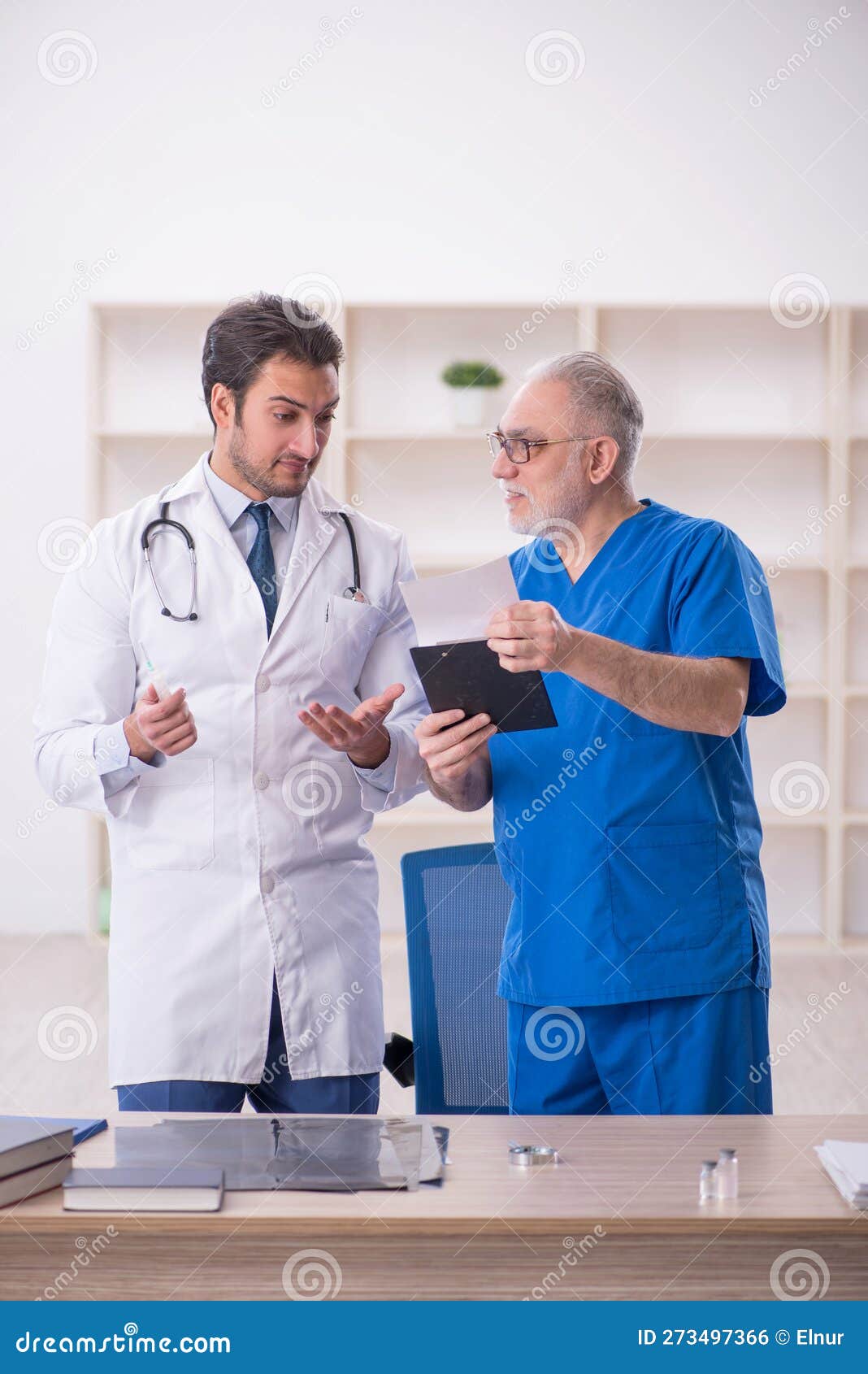 Two Male Doctors Working in the Clinic Stock Photo - Image of treatment ...